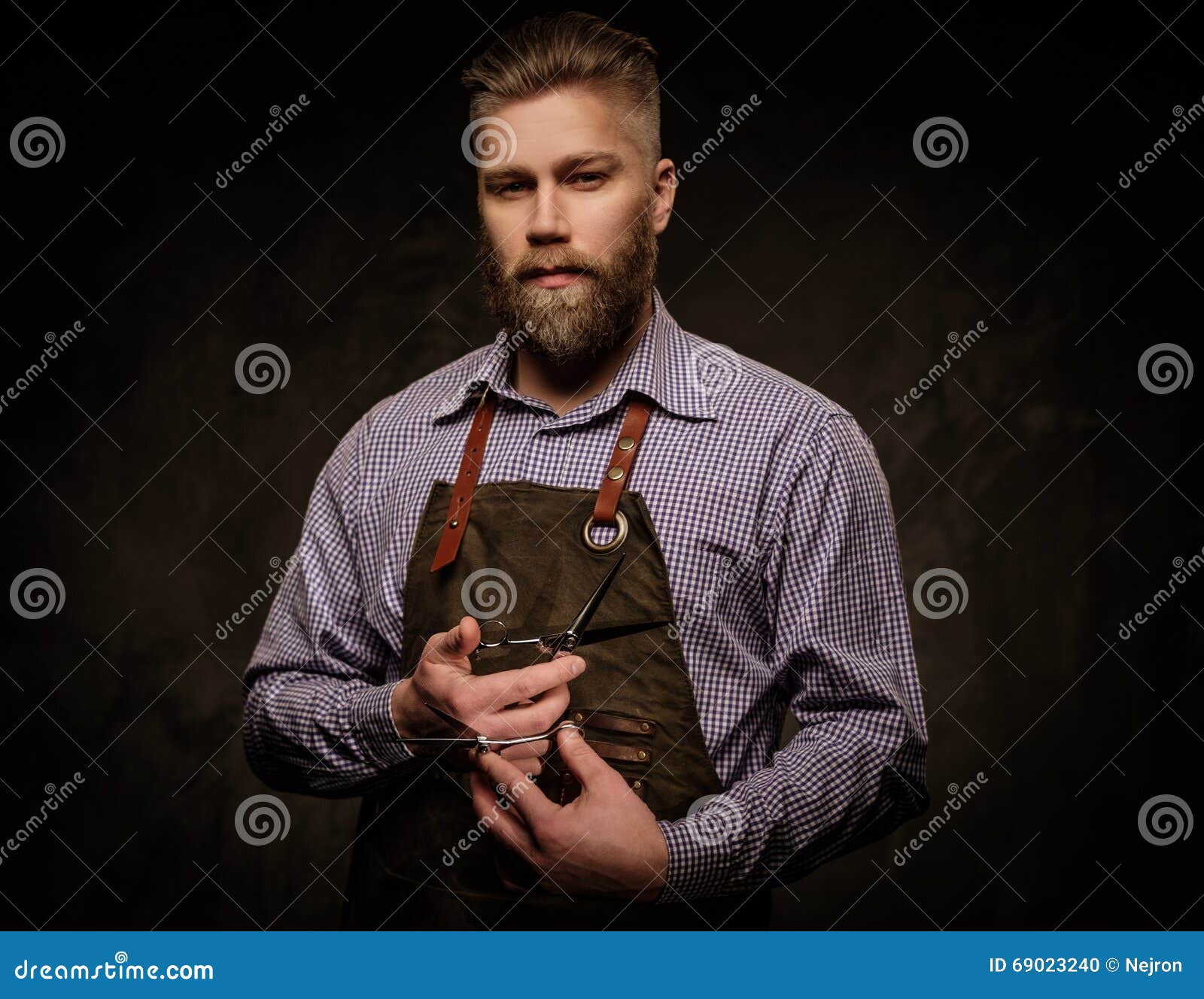 Portrait of Stylish Barber with Beard and Professional Tools on a Dark ...