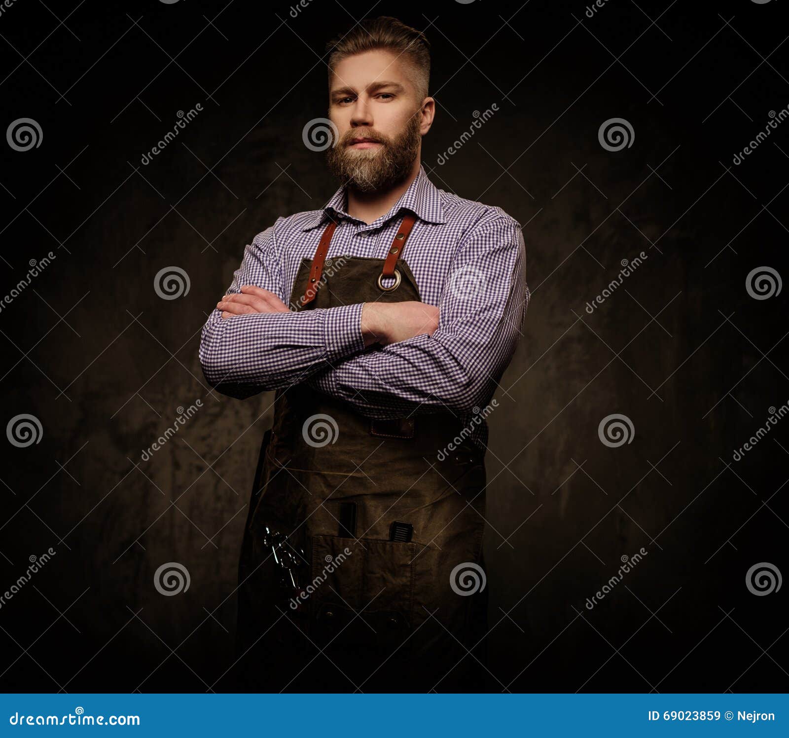 Portrait of Stylish Barber with Beard and Professional Tools on a Dark ...