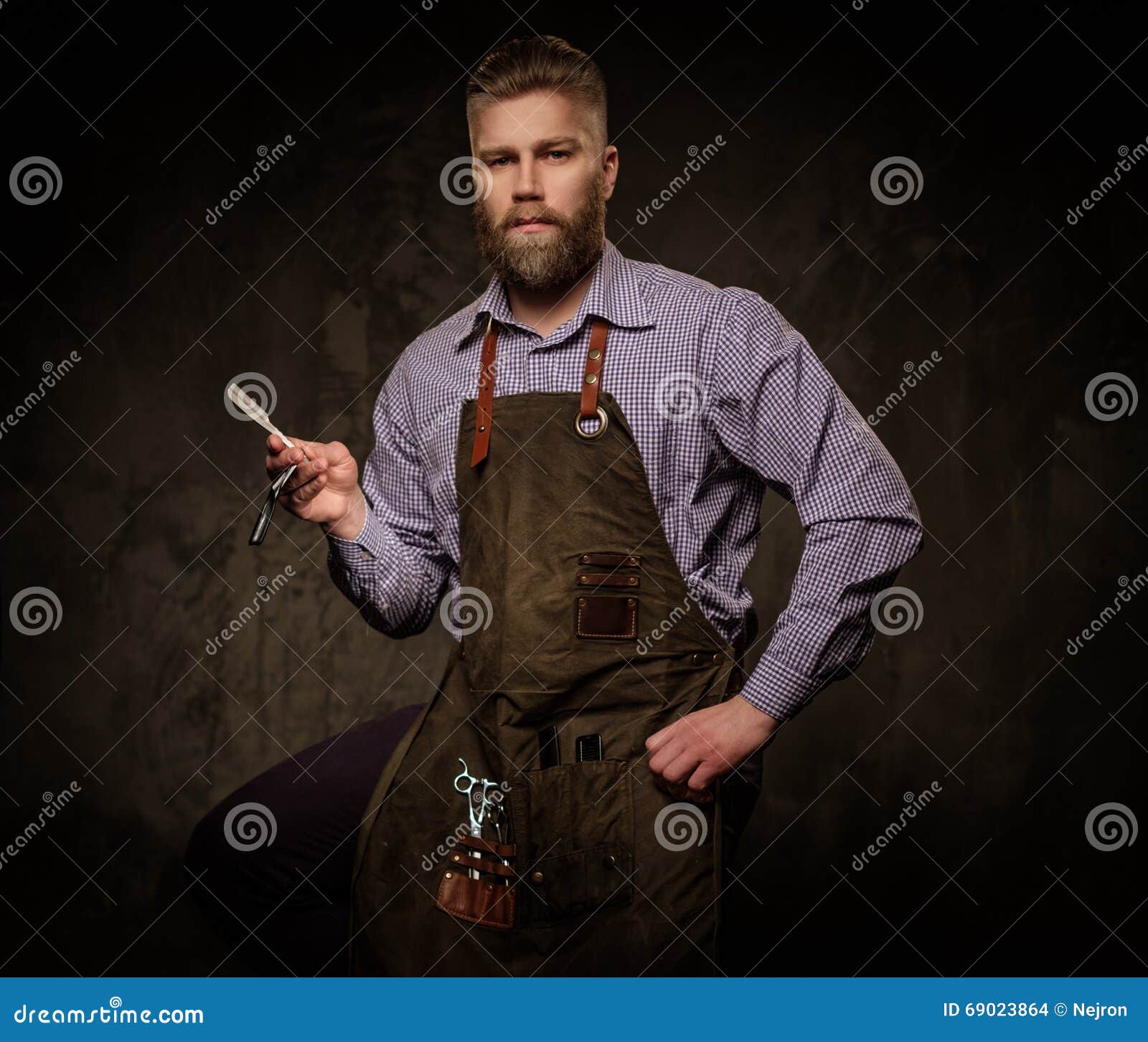 Portrait of Stylish Barber with Beard and Professional Tools on a Dark ...