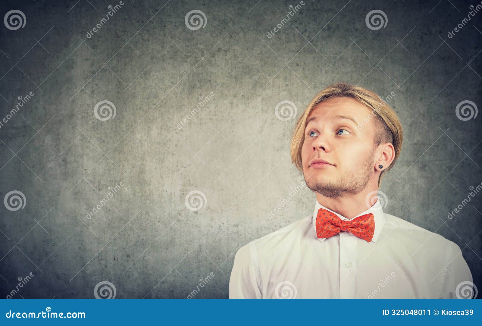 Portrait of a Stylish Young Man Looking Up and To the Side Stock Image ...