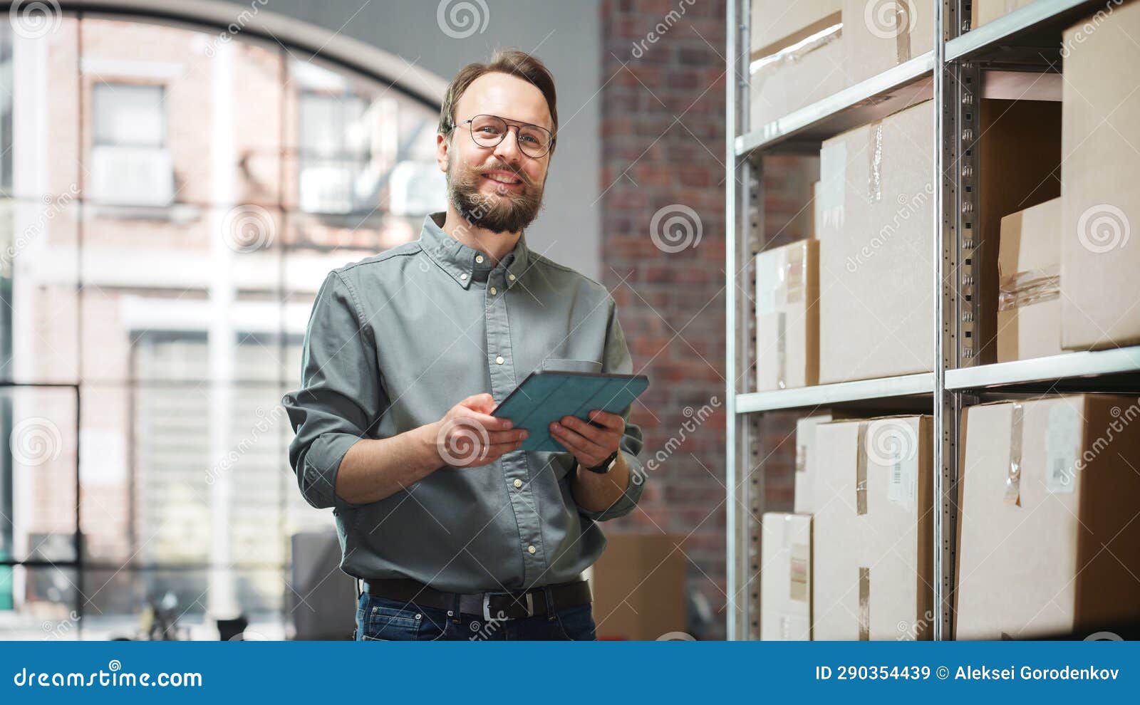 Portrait of a Successful Employee Checking Inventory, Writing in Tablet ...