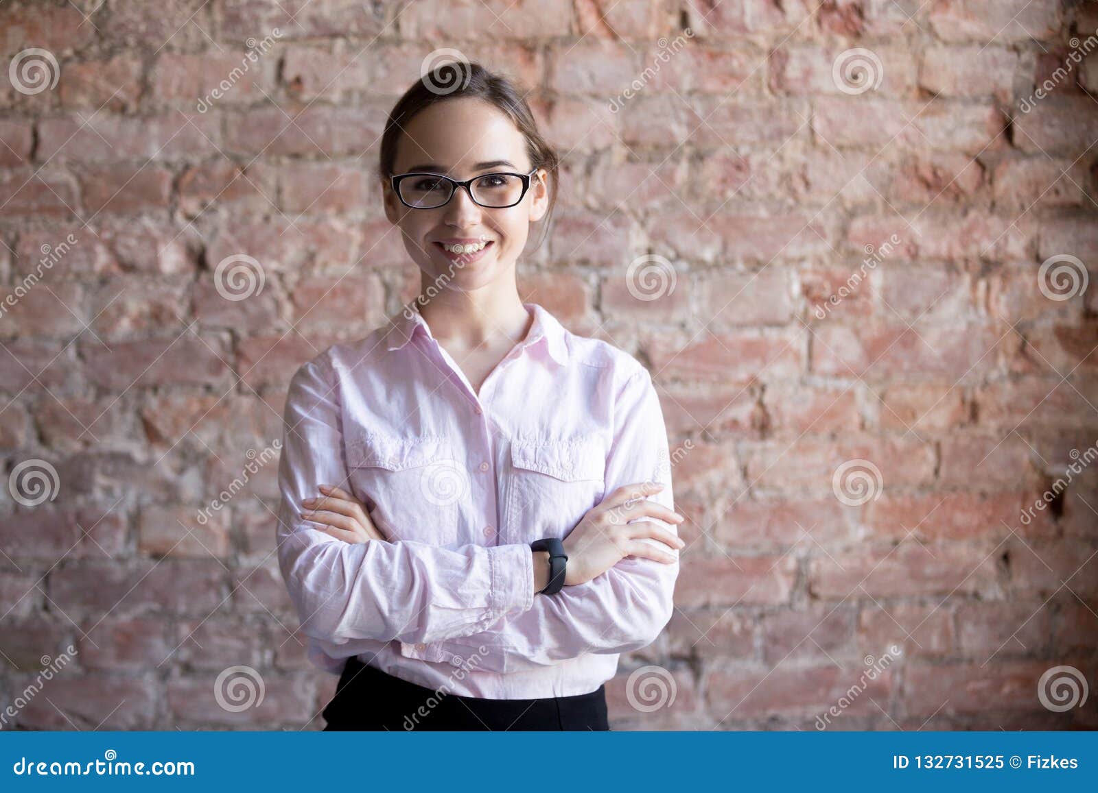 Portrait Of Successful Smiling Businesswoman Wearing Glasses Stock