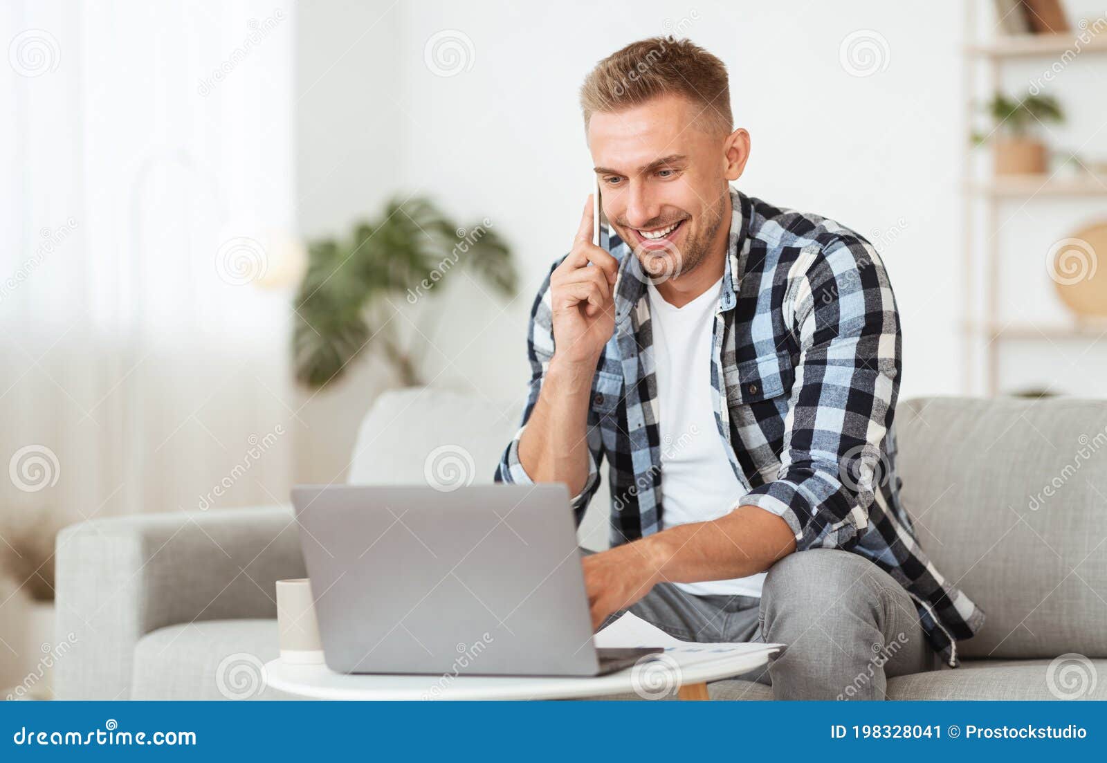 Portrait of Successful Smiling Man Using Pc Talking on Cellphone Stock ...