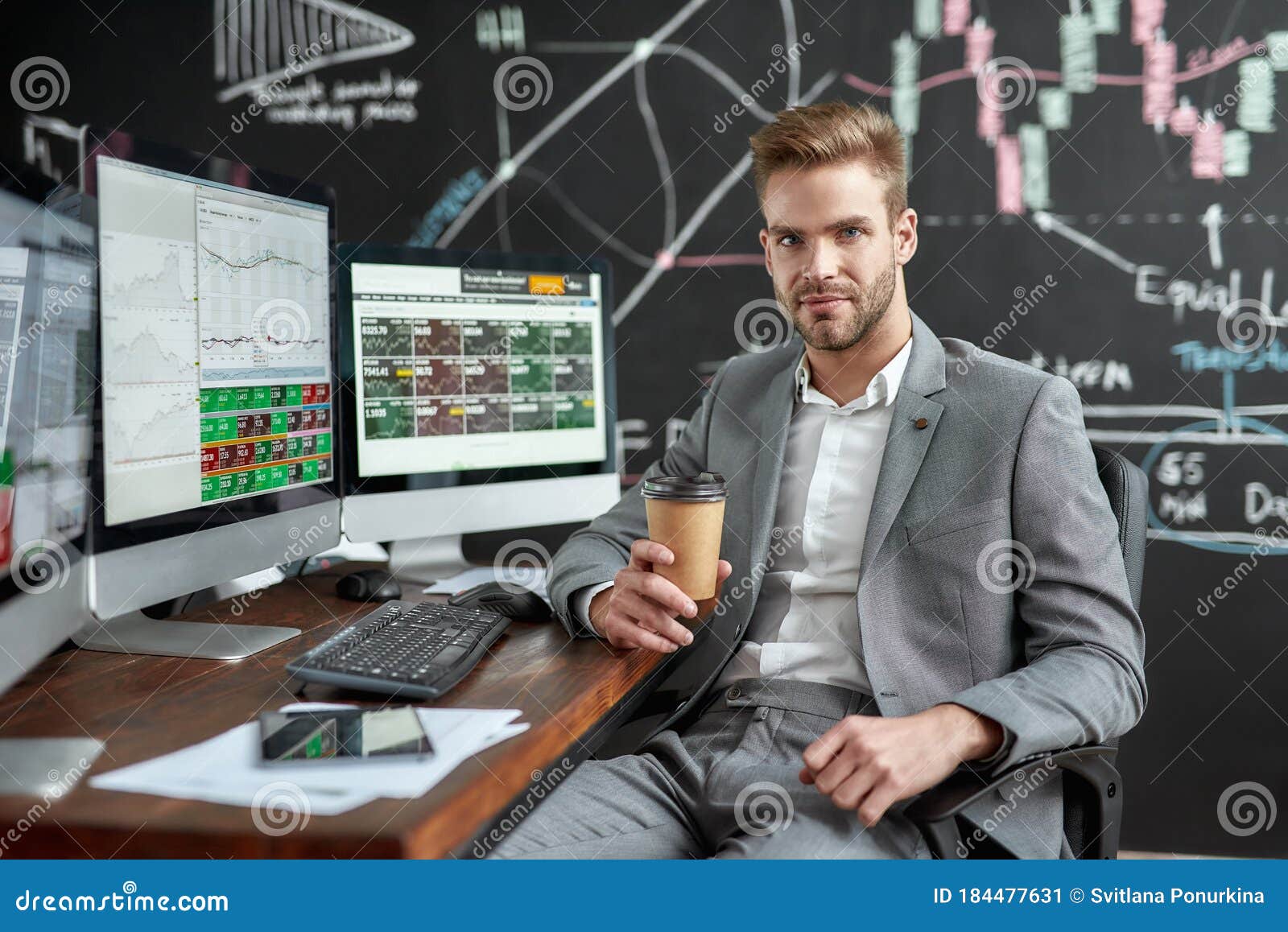 Solving Money Out. Portrait of Successful Young Trader Looking at ...
