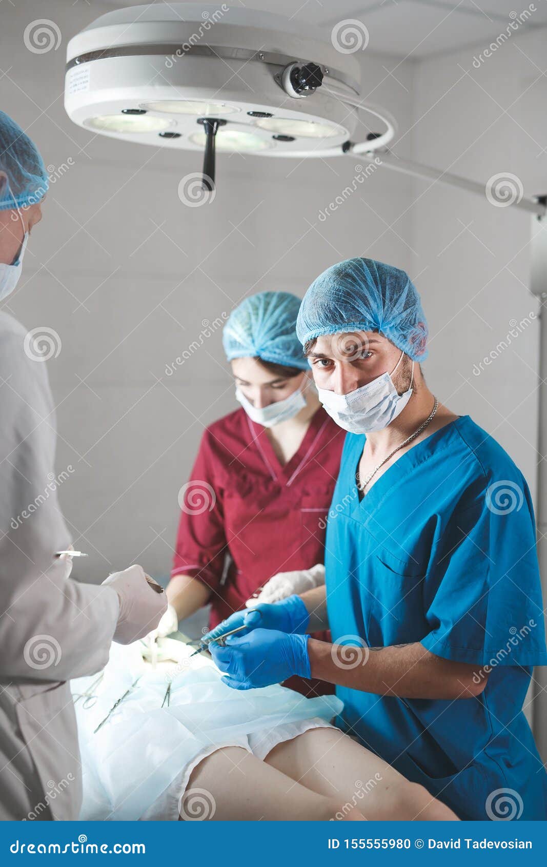 Portrait of Surgeons at Work, Operating in Uniform, Looking at Camera ...