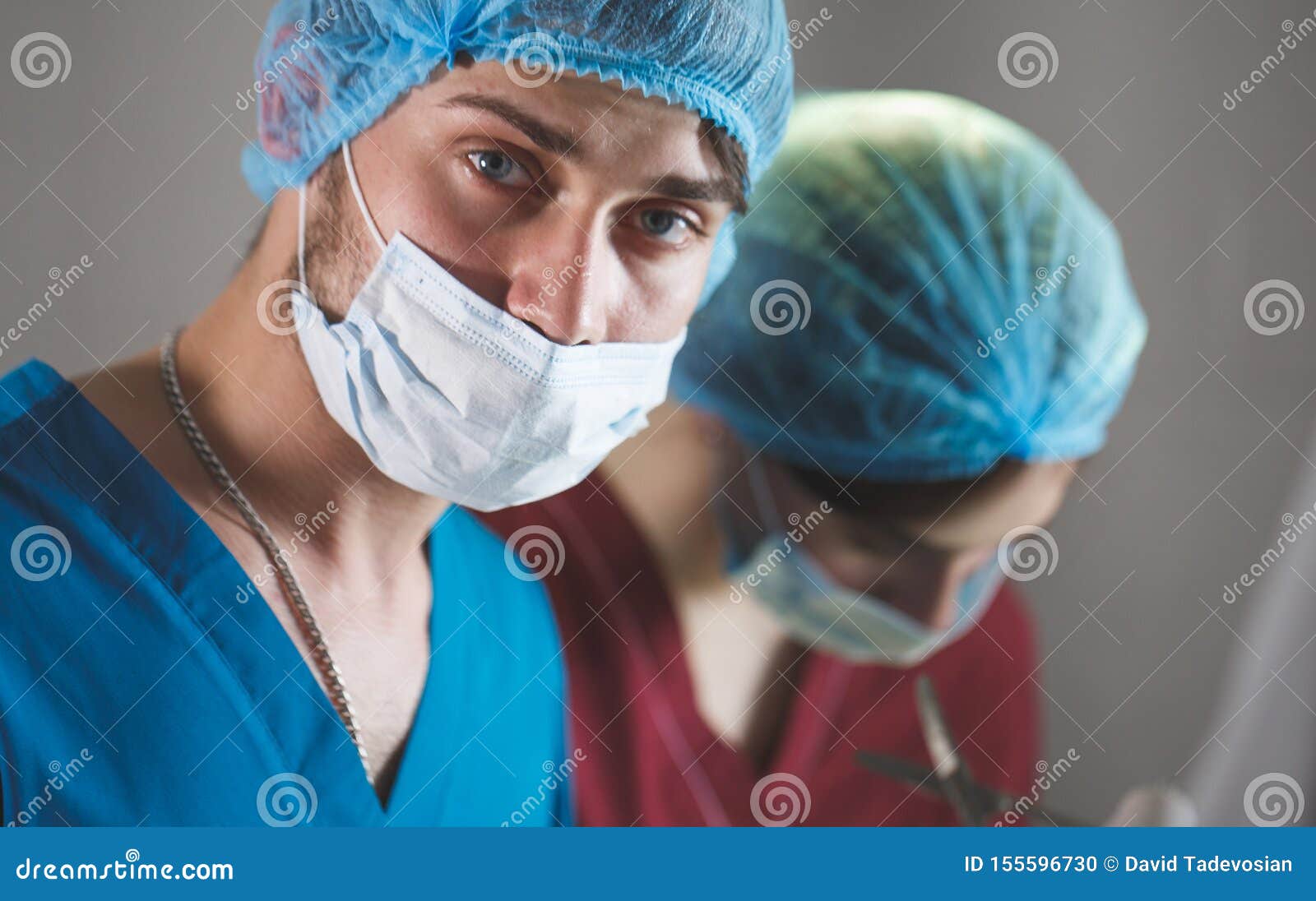 Portrait of Surgeons at Work, Operating in Uniform, Looking at Camera ...