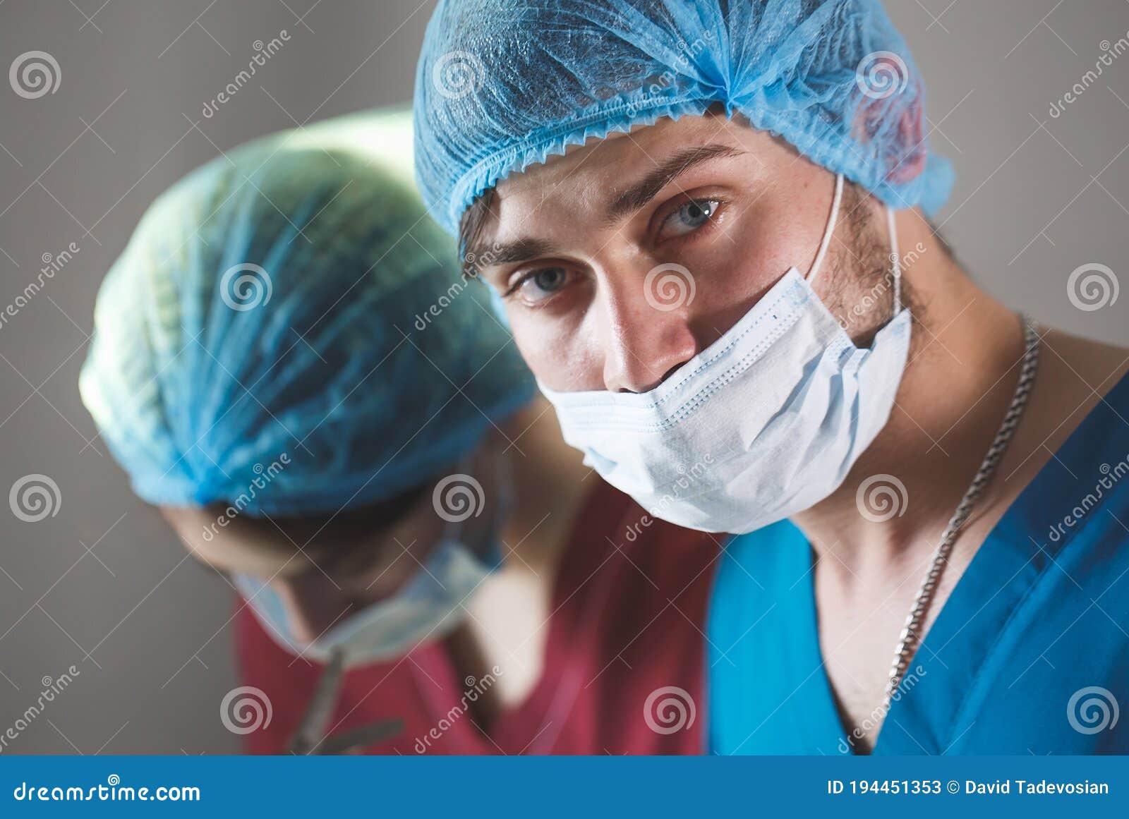 Portrait of Surgeons at Work, Operating in Uniform, Looking at Camera ...