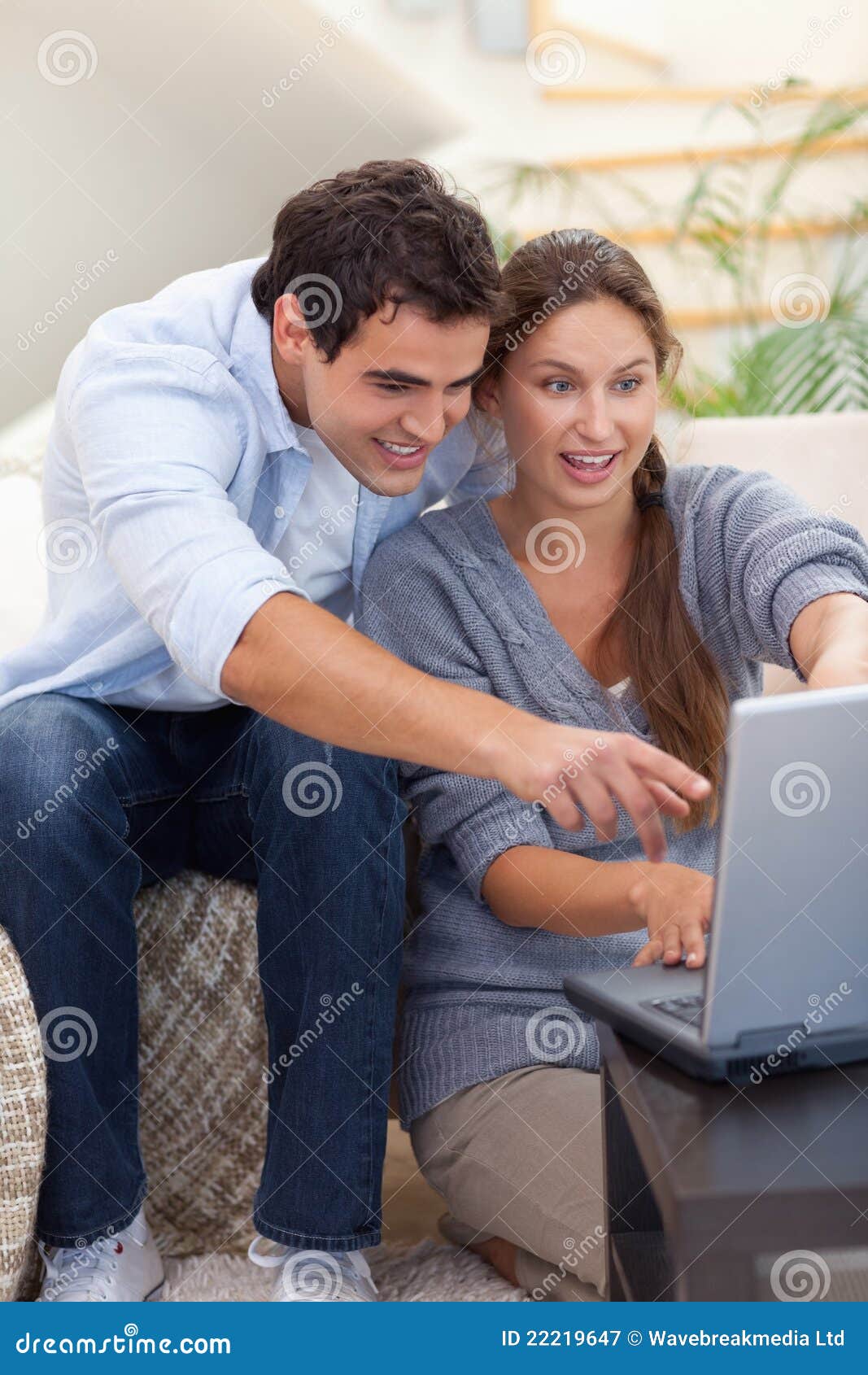 Portrait of a Surprised Couple Using a Notebook Stock Image - Image of ...