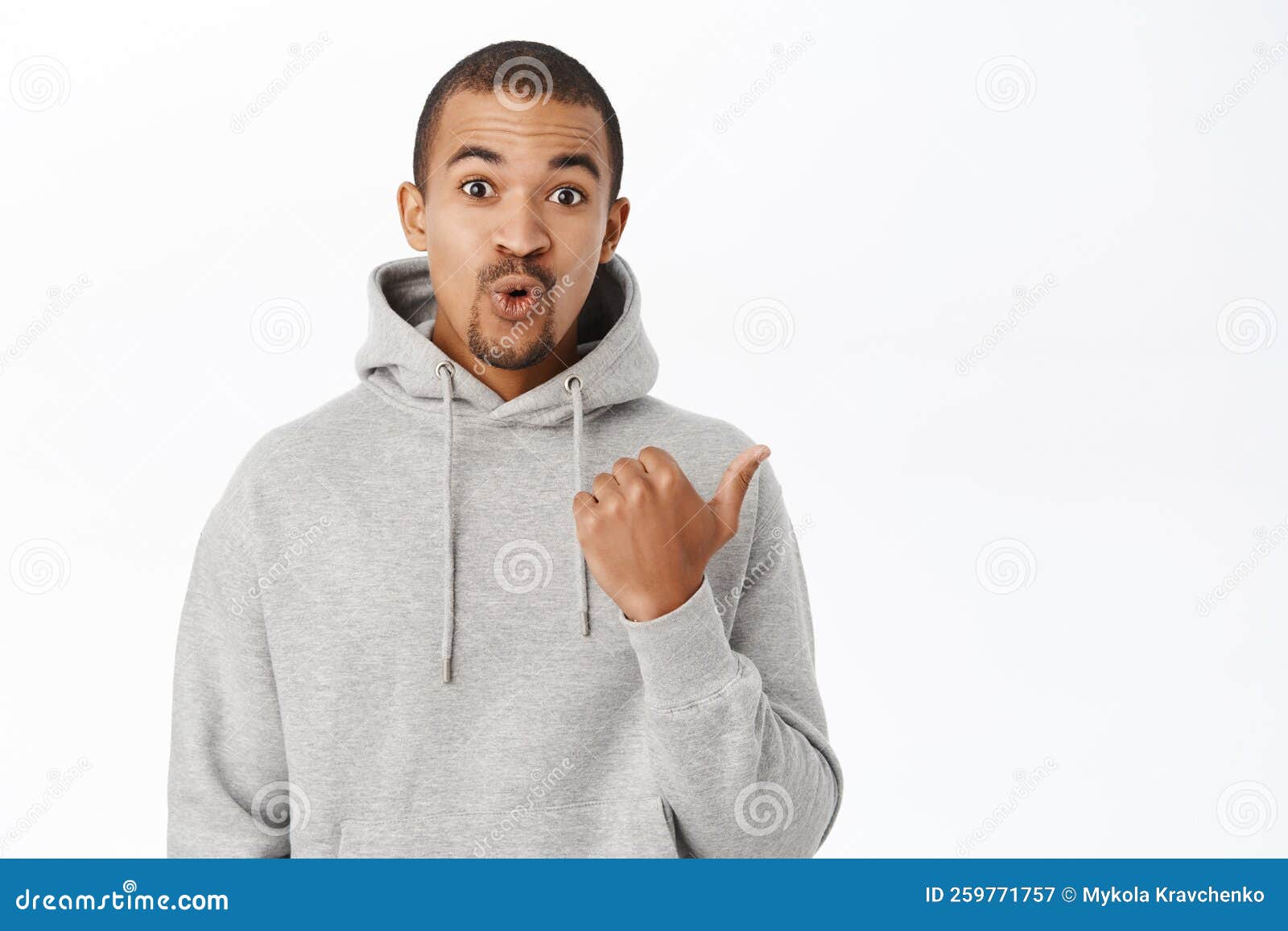 Portrait of Surprised Handsome Guy Points Right, Shows Banner or Logo ...