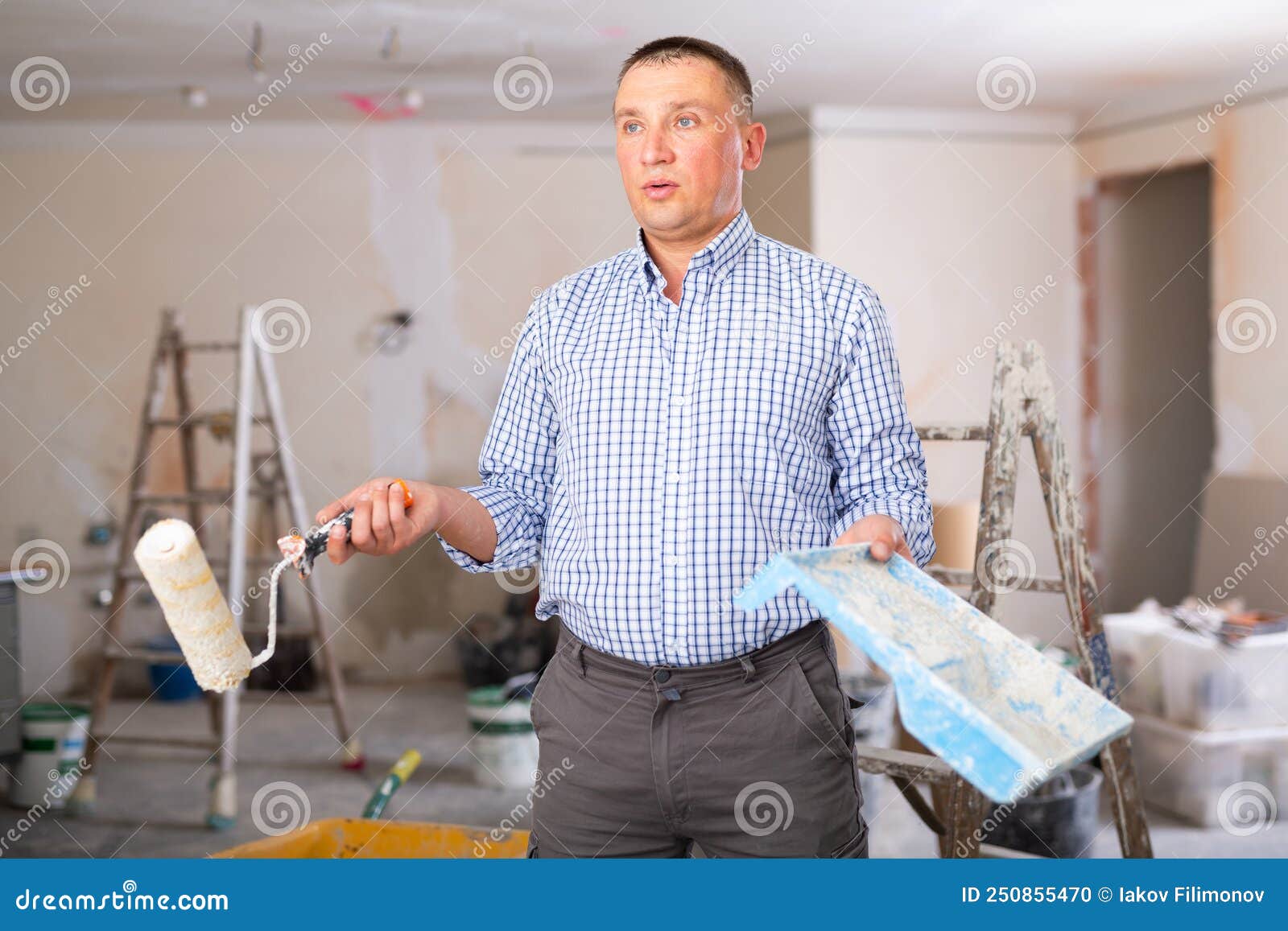 Portrait of a Surprised Man with Paint Roller in His Hands Stock Photo ...