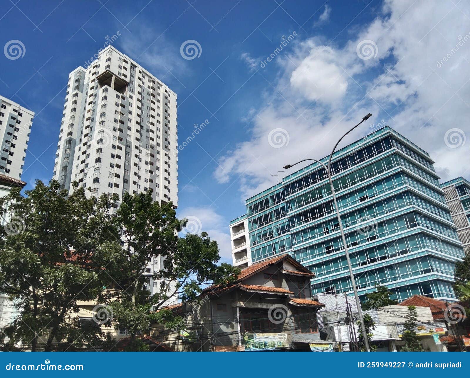 Portrait of a Tall Building in the Middle of the City from the Bottom ...