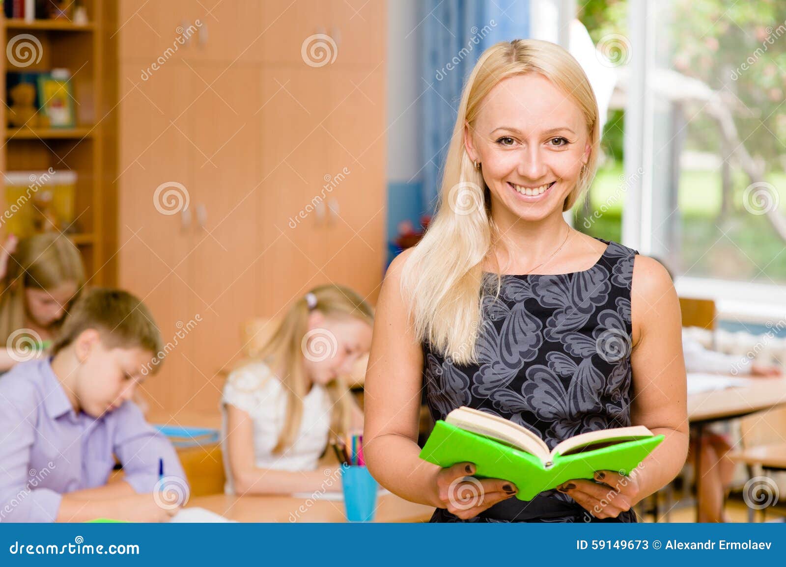 Portrait of a Teacher on a Background of Pupils Stock Image - Image of ...