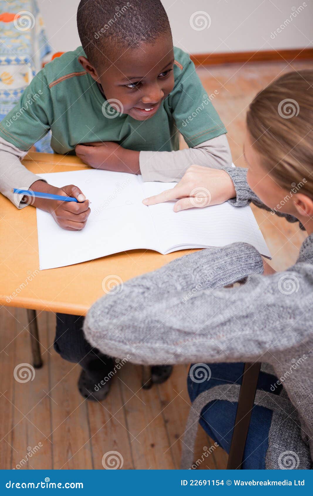 Portrait of a Teacher Explaining Something To a Schoolboy Stock Photo ...