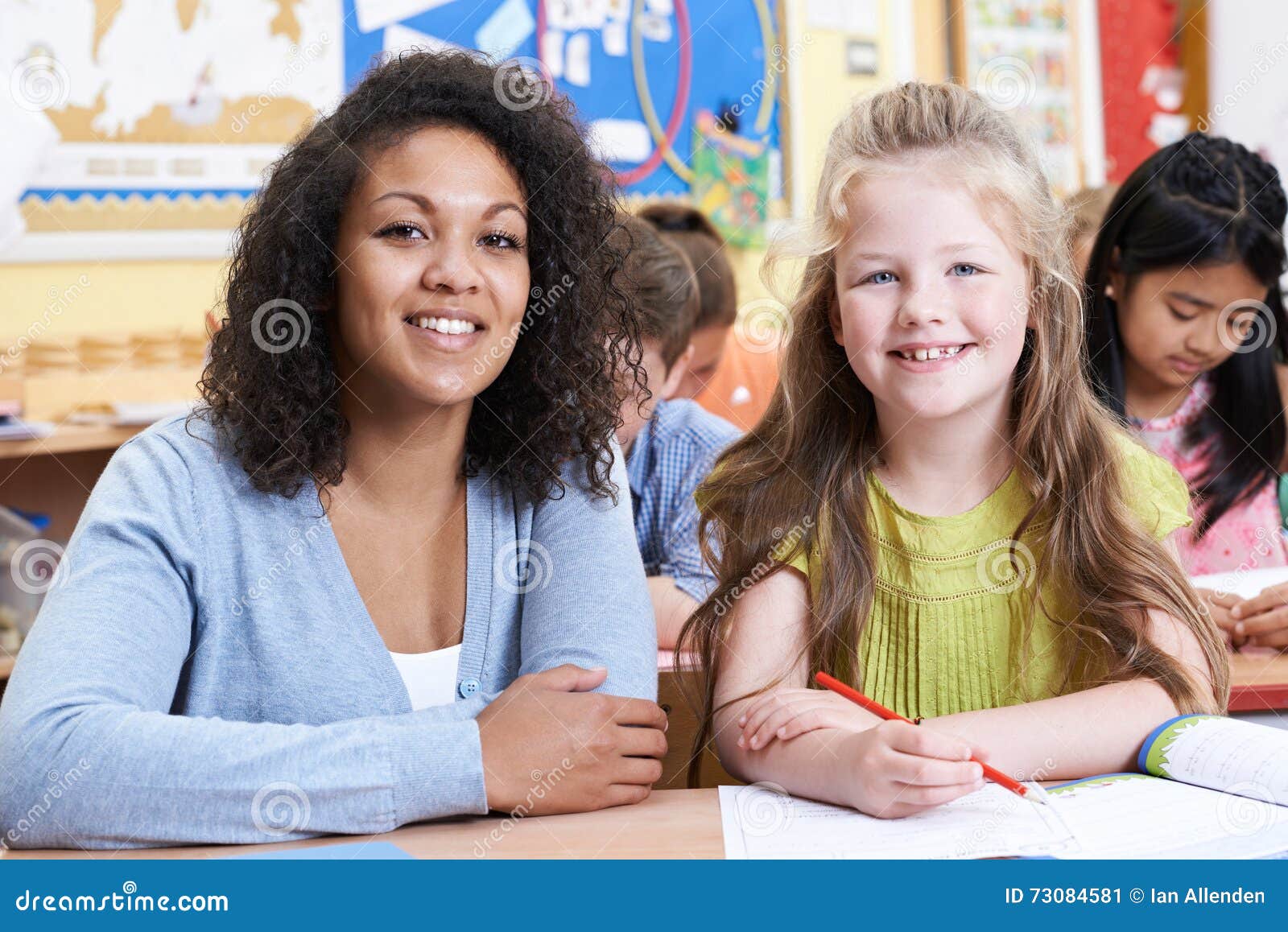 Portrait of Teacher with Female Elementary School Pupil in Class Stock ...