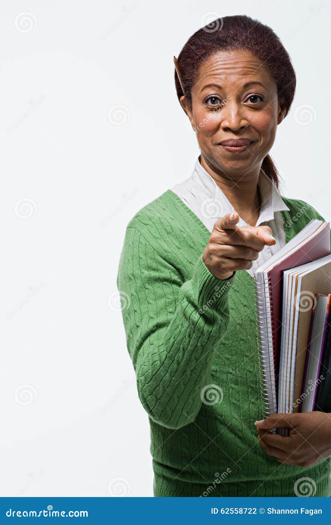 Portrait of Teacher Holding Books Stock Photo - Image of front ...