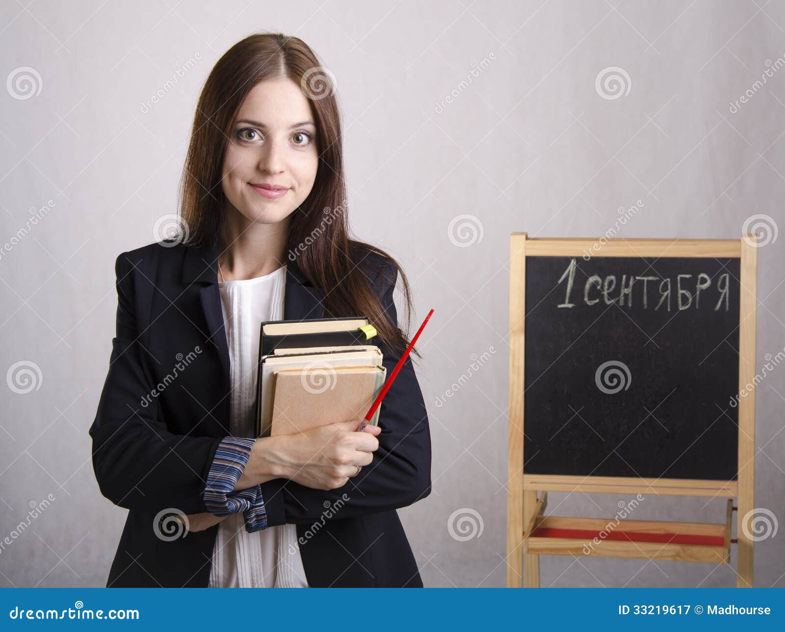 Portrait of the Teacher with Textbooks and Board in the Background ...