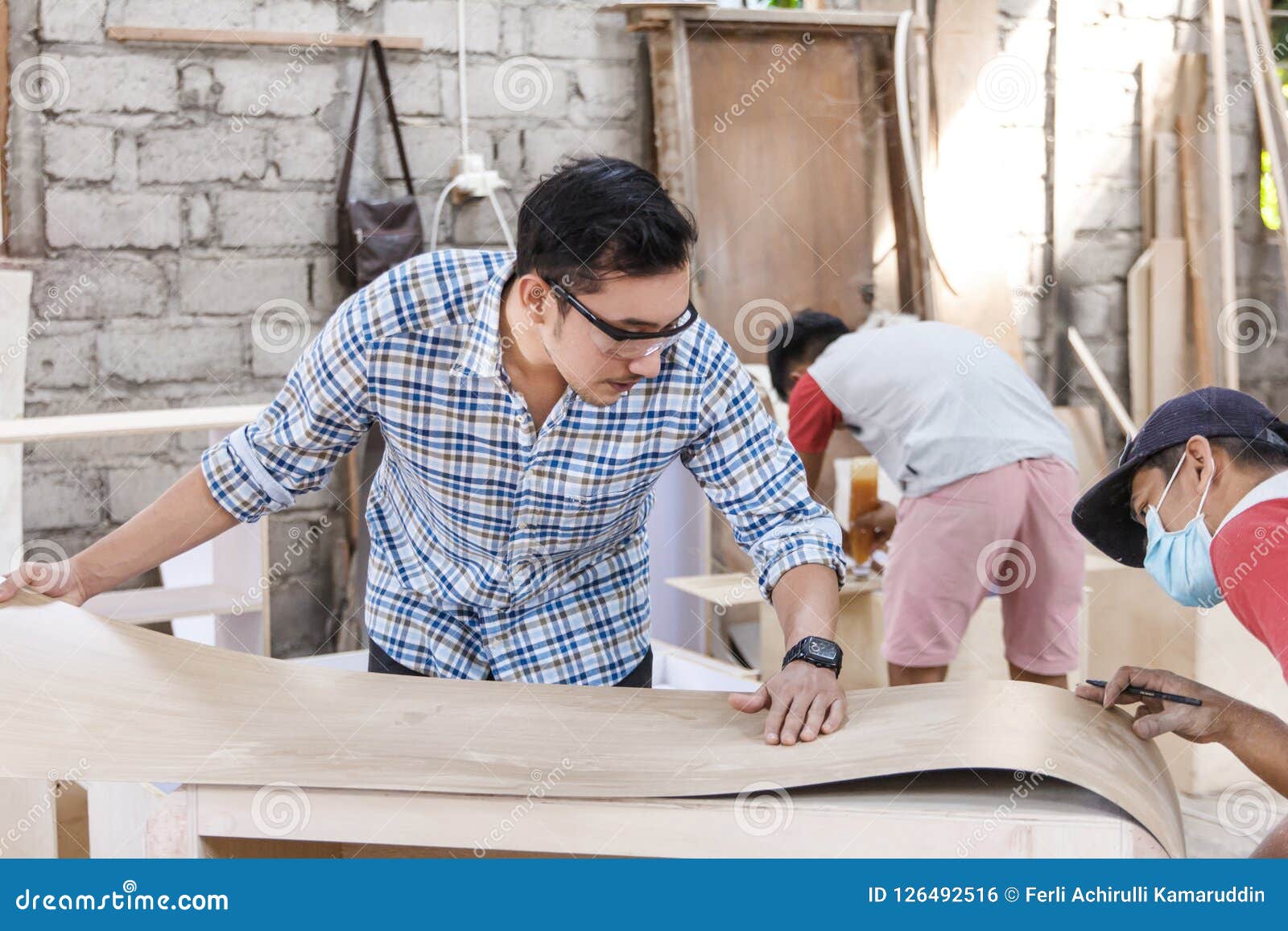 Teamwork On The Building Site - Construction Workers Build A Family ...