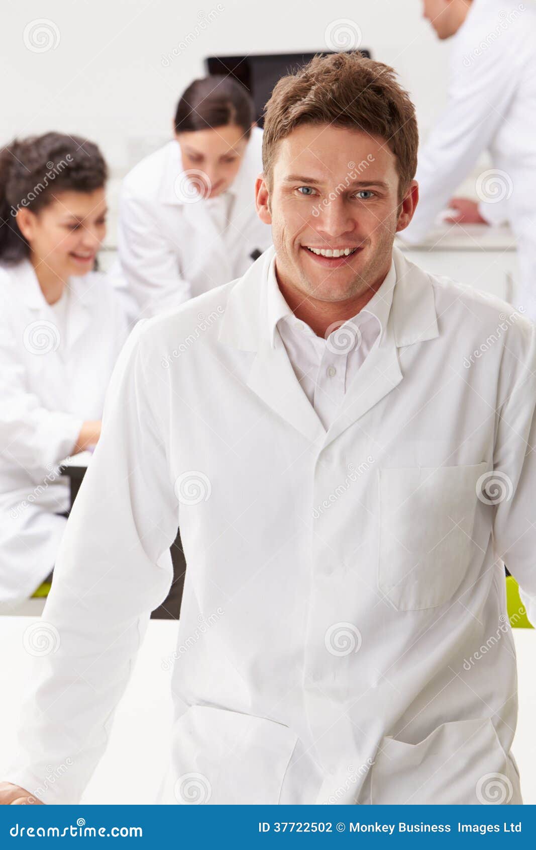 Portrait of Technician in Laboratory with Colleagues Stock Photo ...