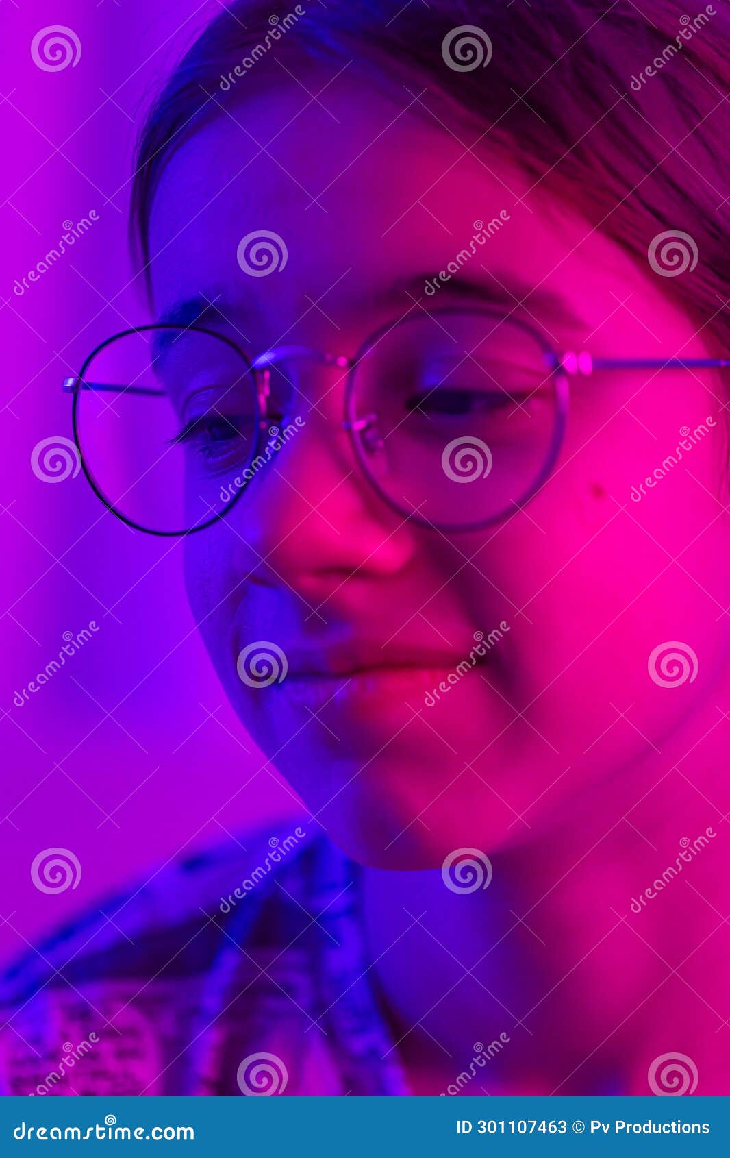 Portrait Of A Teenage Girl With Glasses In Neon Light Stock Image