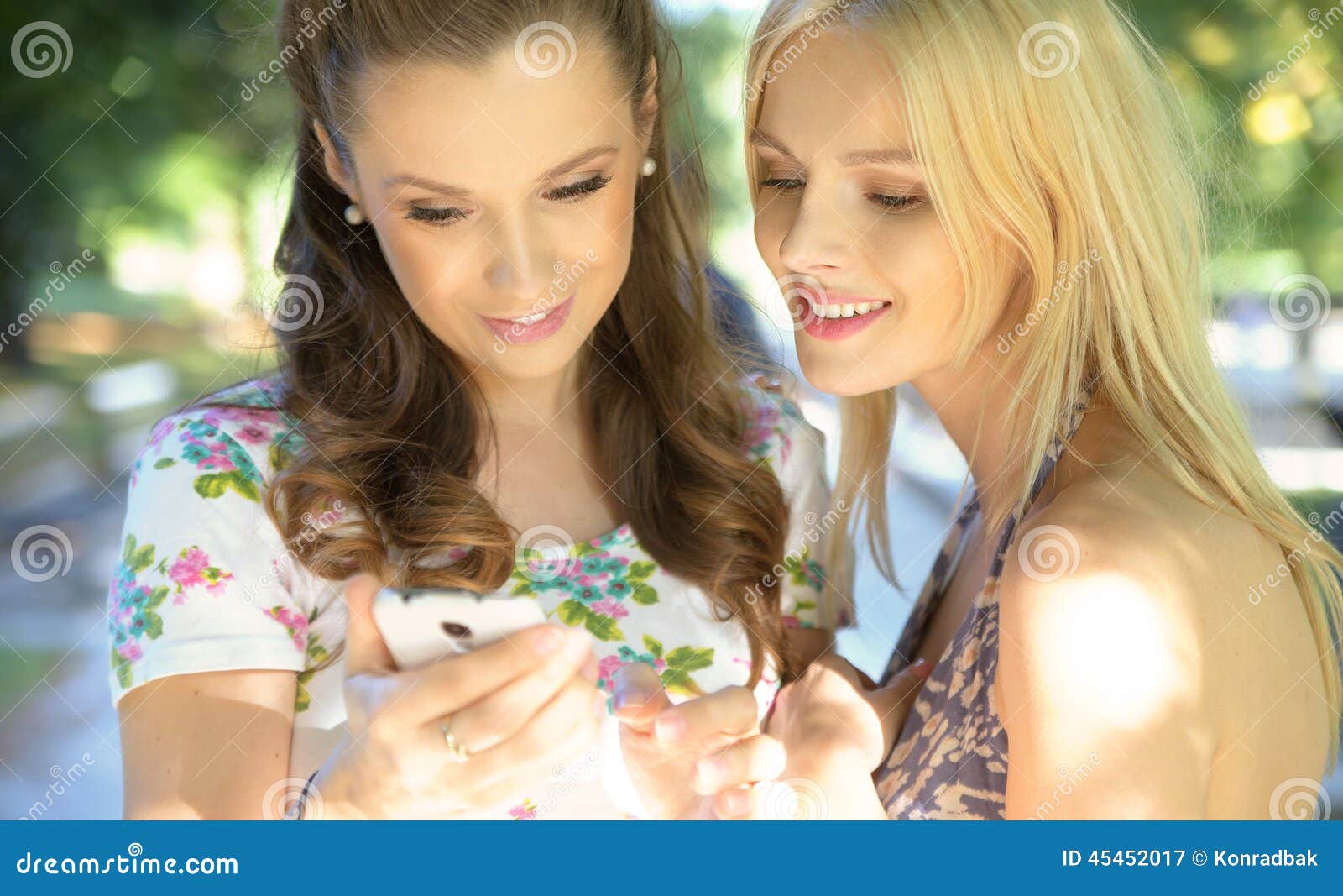 Portrait of the Texting Girlfriends Stock Image - Image of outdoors ...