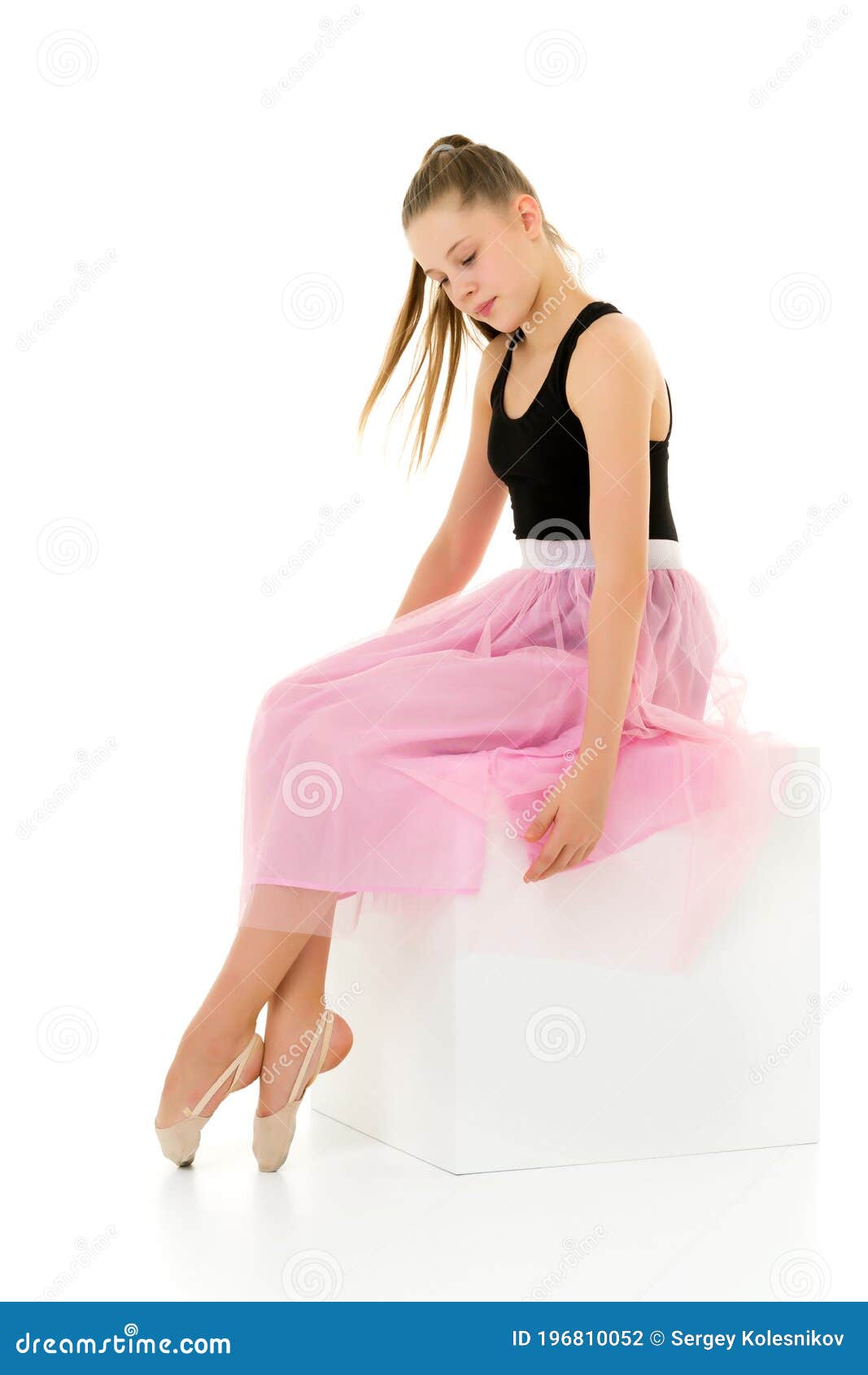 Portrait of Thoughtful Beautiful Girl Sitting on White Cube Stock Photo ... Portrait of Thoughtful Beautiful Girl Sitting on White Cube Stock Photo ...