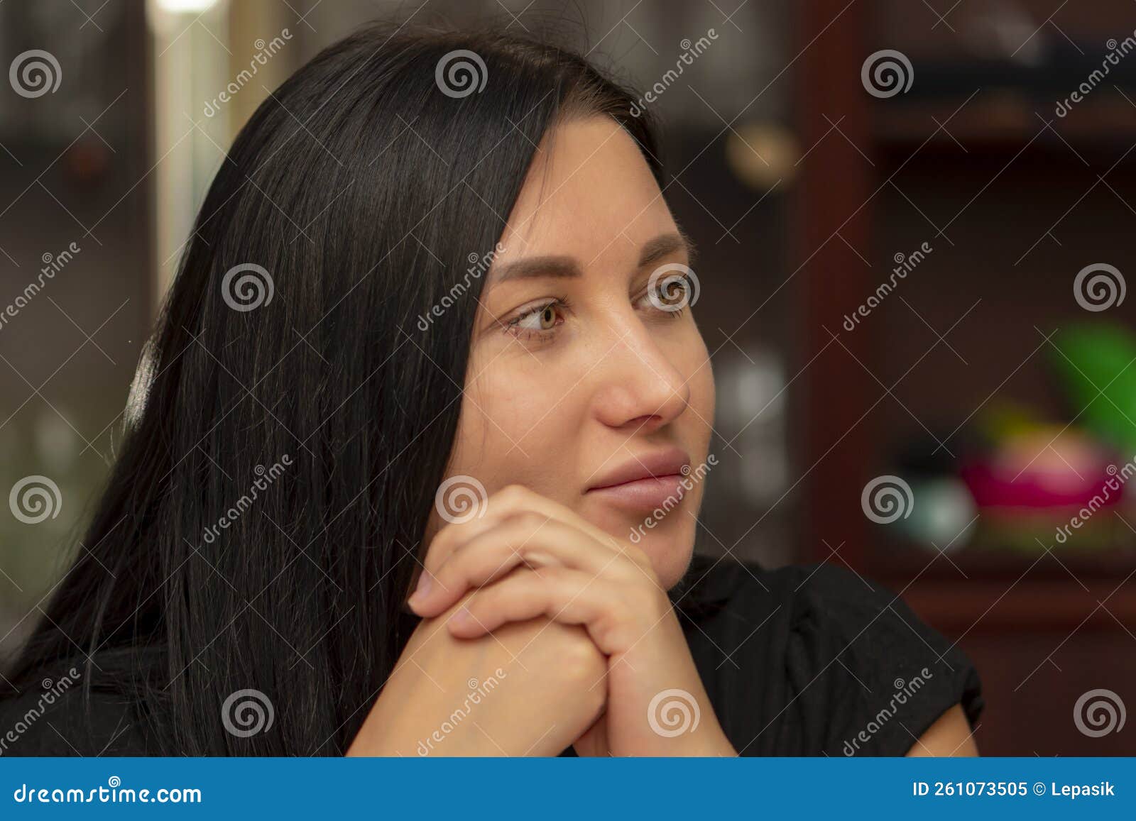 Portrait Of A Thoughtful Beautiful 30 Year Old Woman With Long Hair