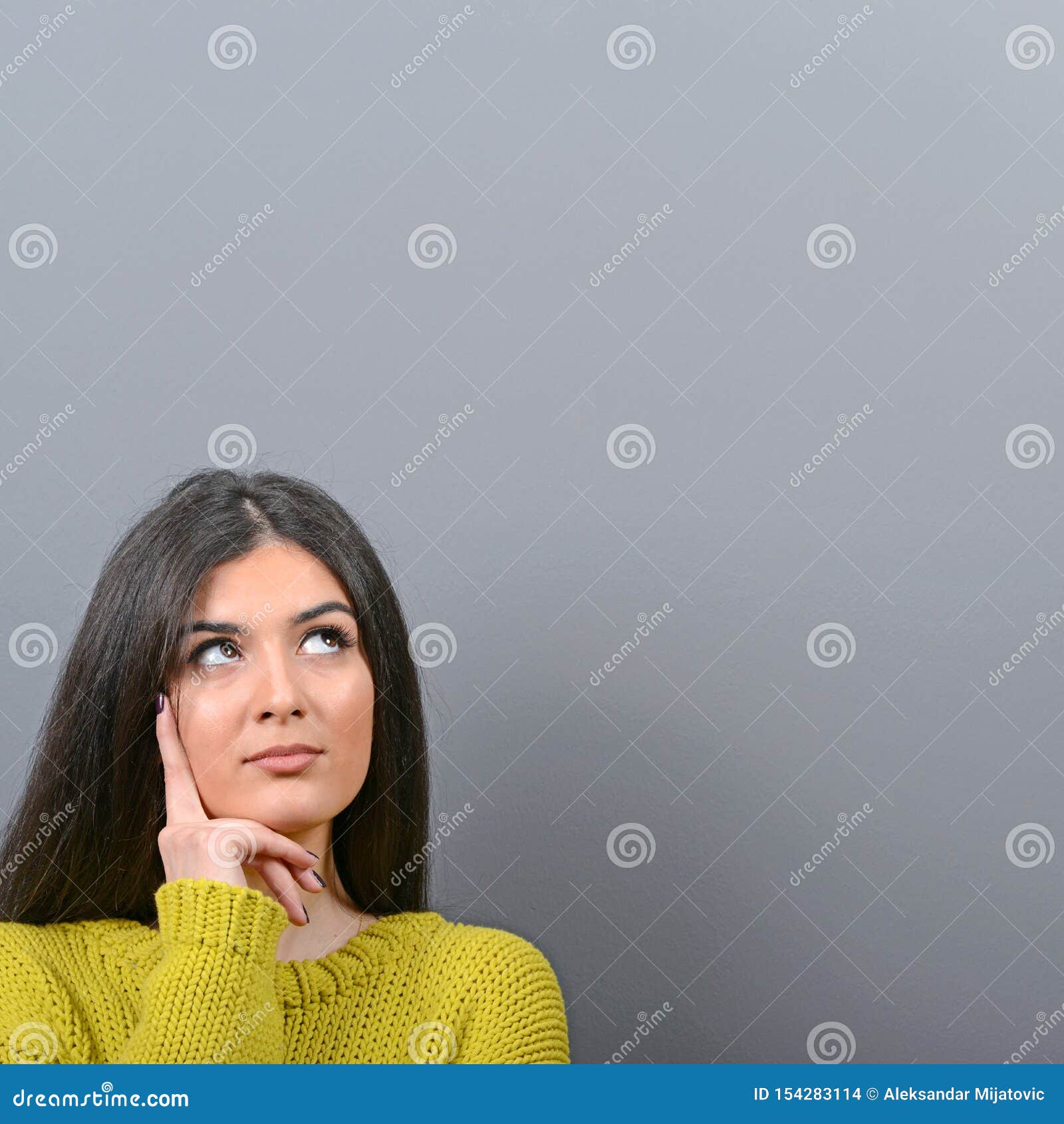 Portrait of Thoughtful Business Woman Against Gray Background Stock ... Portrait of Thoughtful Business Woman Against Gray Background Stock ...
