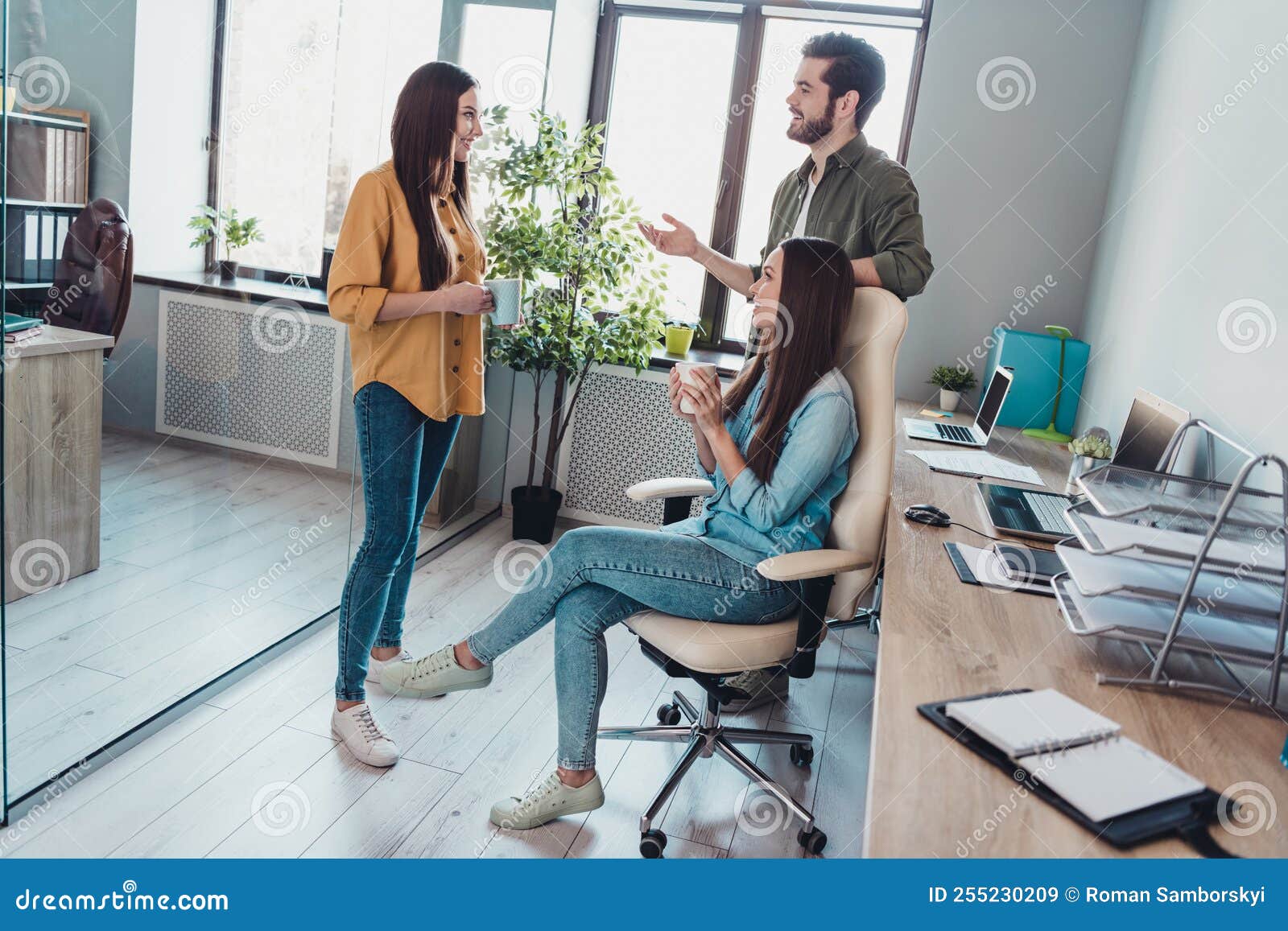 Portrait of Three Attractive Cheerful Partners Drinking Beverage ...