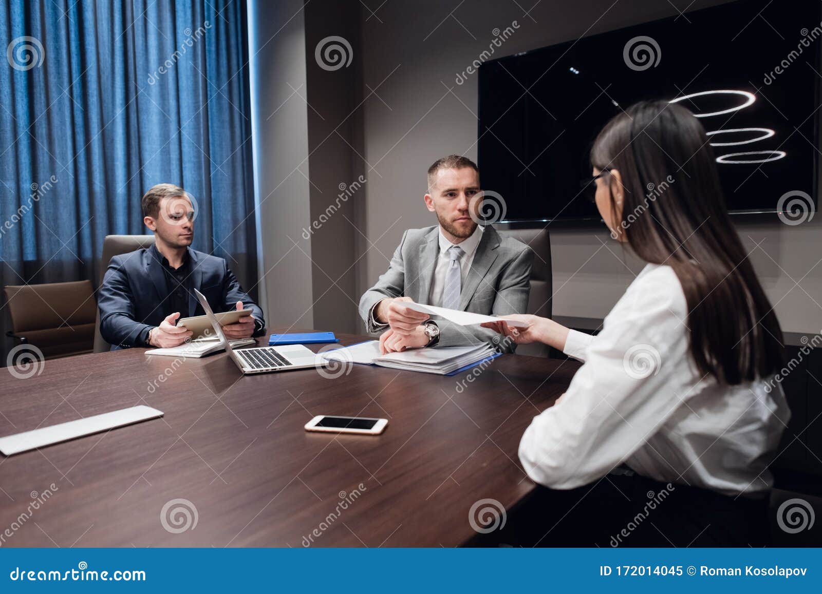 Portrait of Three Co-workers Discussing Business Plan in Office Stock ...