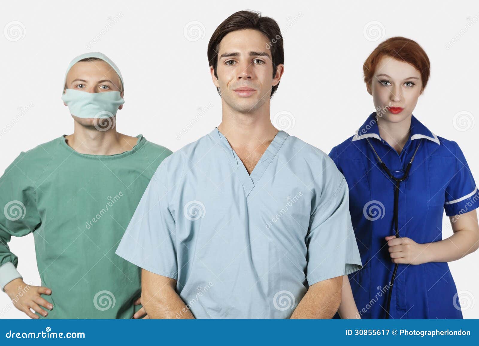 Portrait of Three Confident Medical Practitioners Against Gray ...