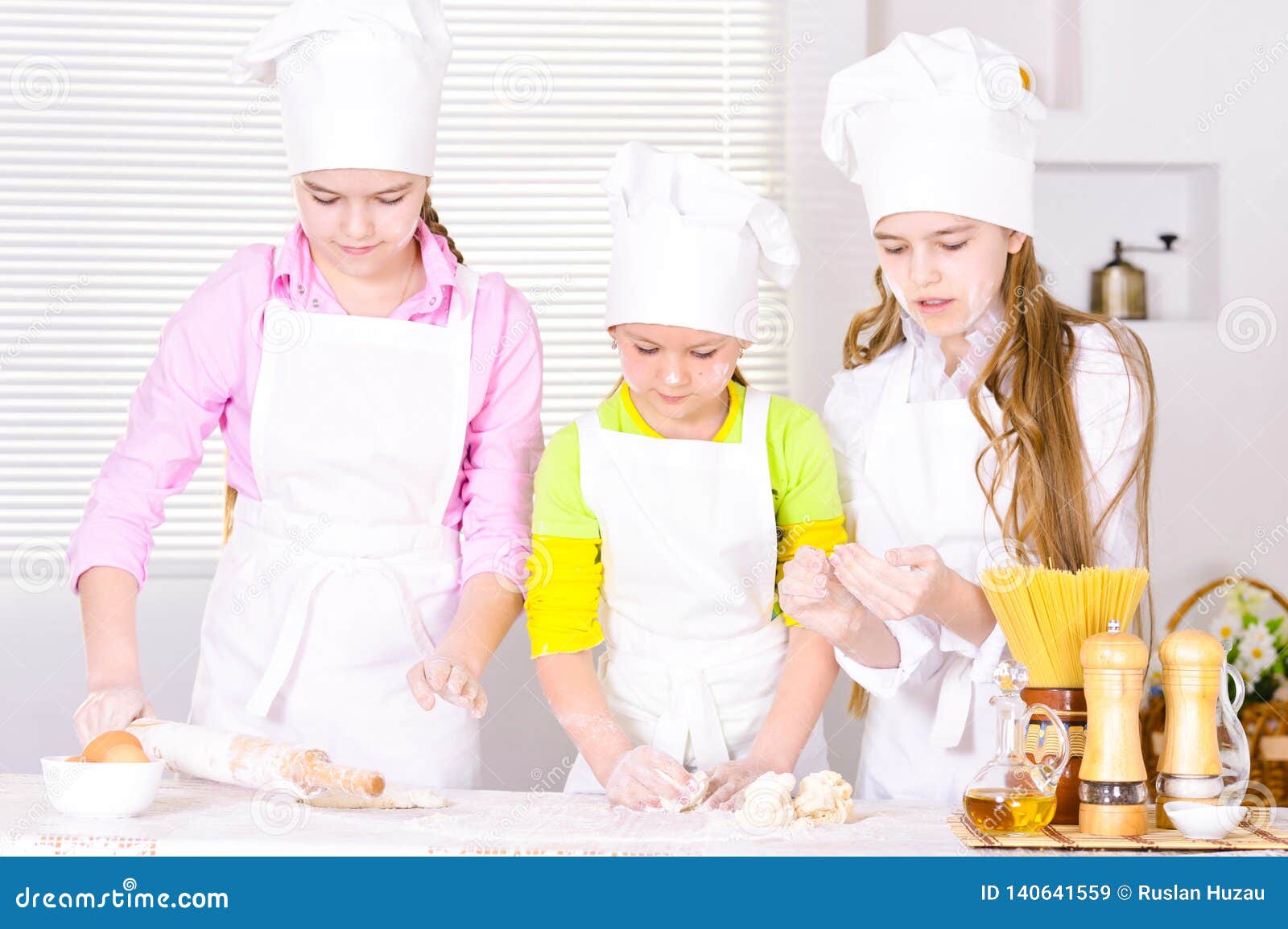 Portrait of Three Cute Girls Cooking on Kitchen Stock Image - Image of ...