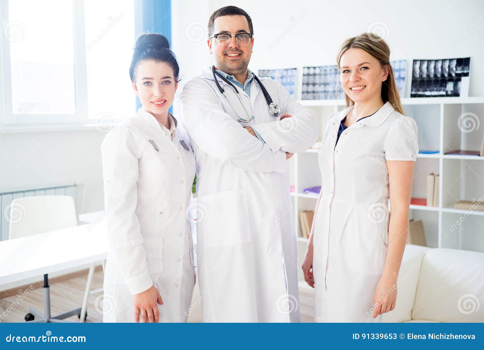 Portrait of three doctors stock image. Image of employment - 91339653