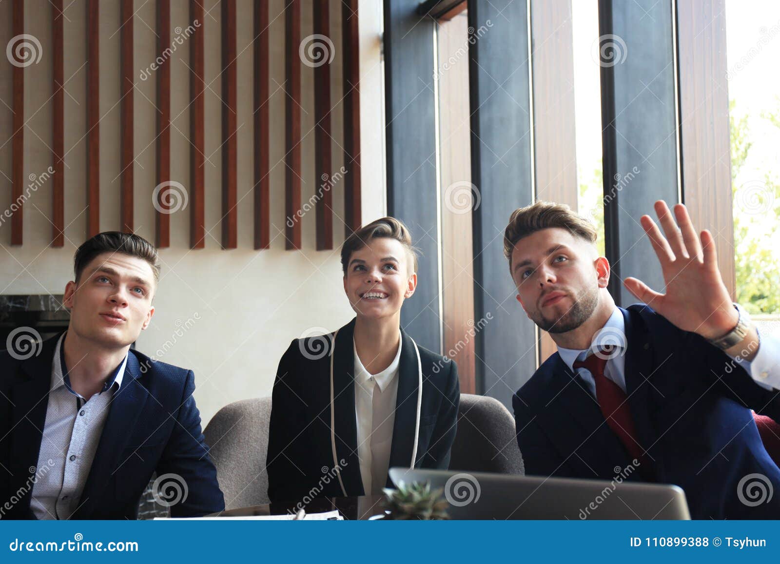 Portrait of Three Partners Discussing Ideas at Meeting. Stock Photo ...