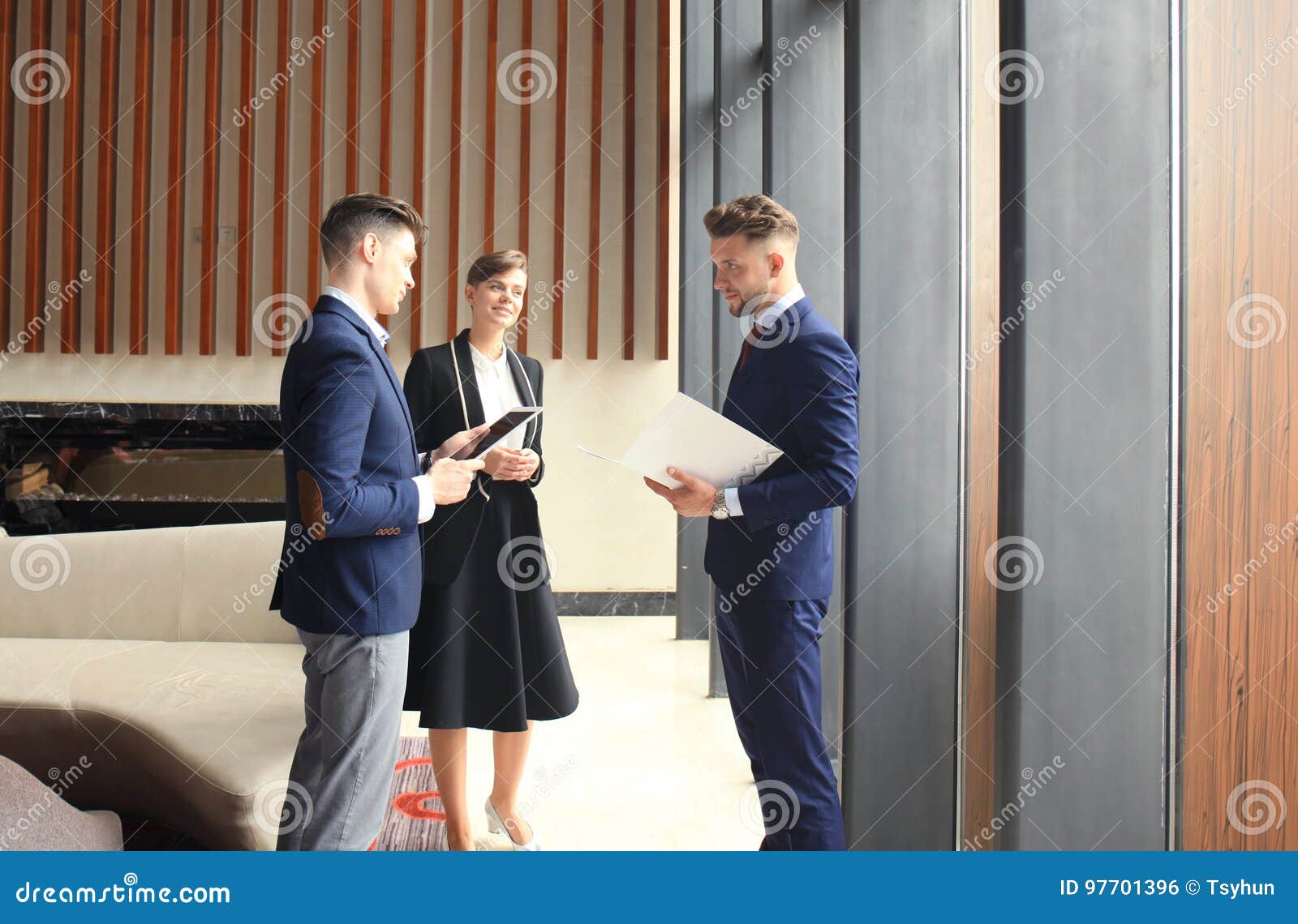 Portrait of Three Partners Discussing Ideas at Meeting. Stock Photo ...