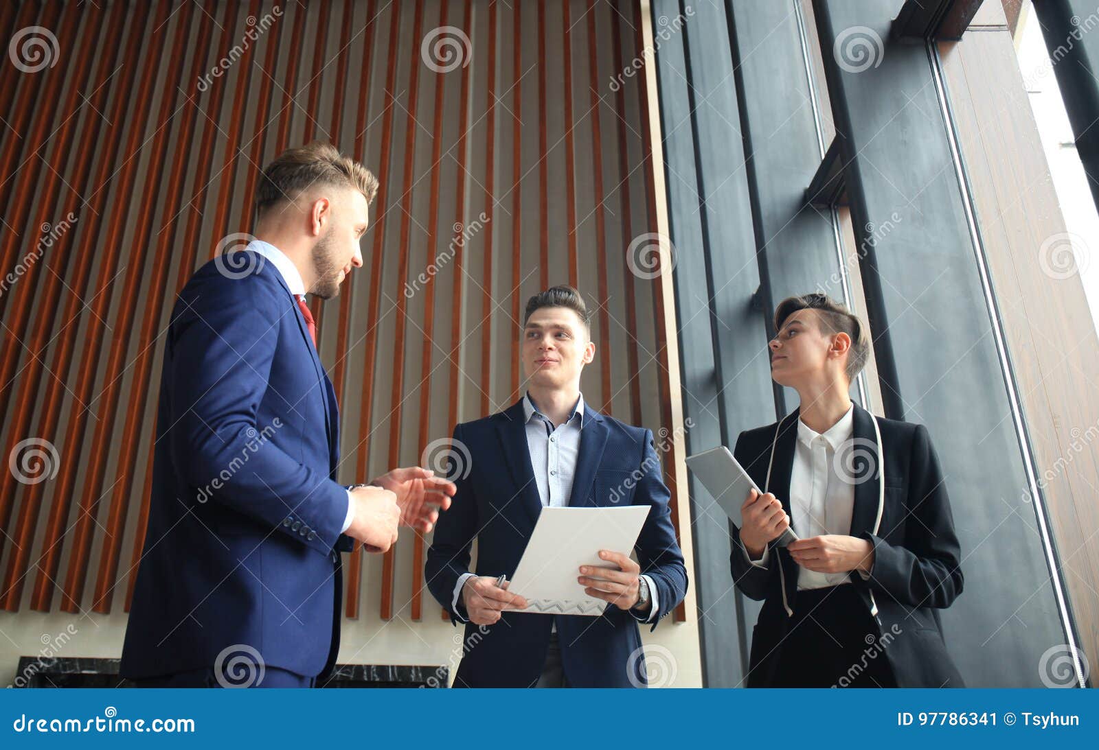 Portrait of Three Partners Discussing Ideas at Meeting. Stock Image ...