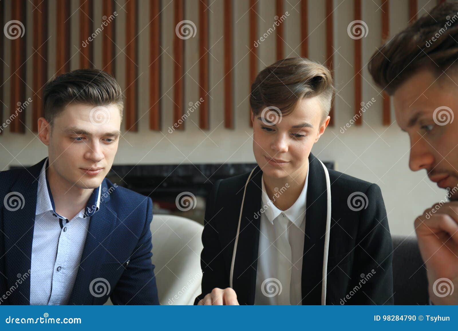 Portrait of Three Partners Discussing Ideas at Meeting. Stock Photo ...