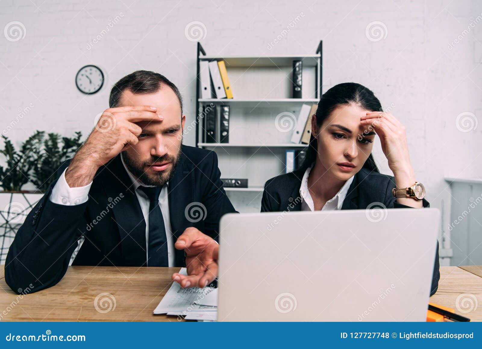 Portrait of Tired Business People Looking at Laptop Screen at Workplace ... Portrait of Tired Business People Looking at Laptop Screen at Workplace ...