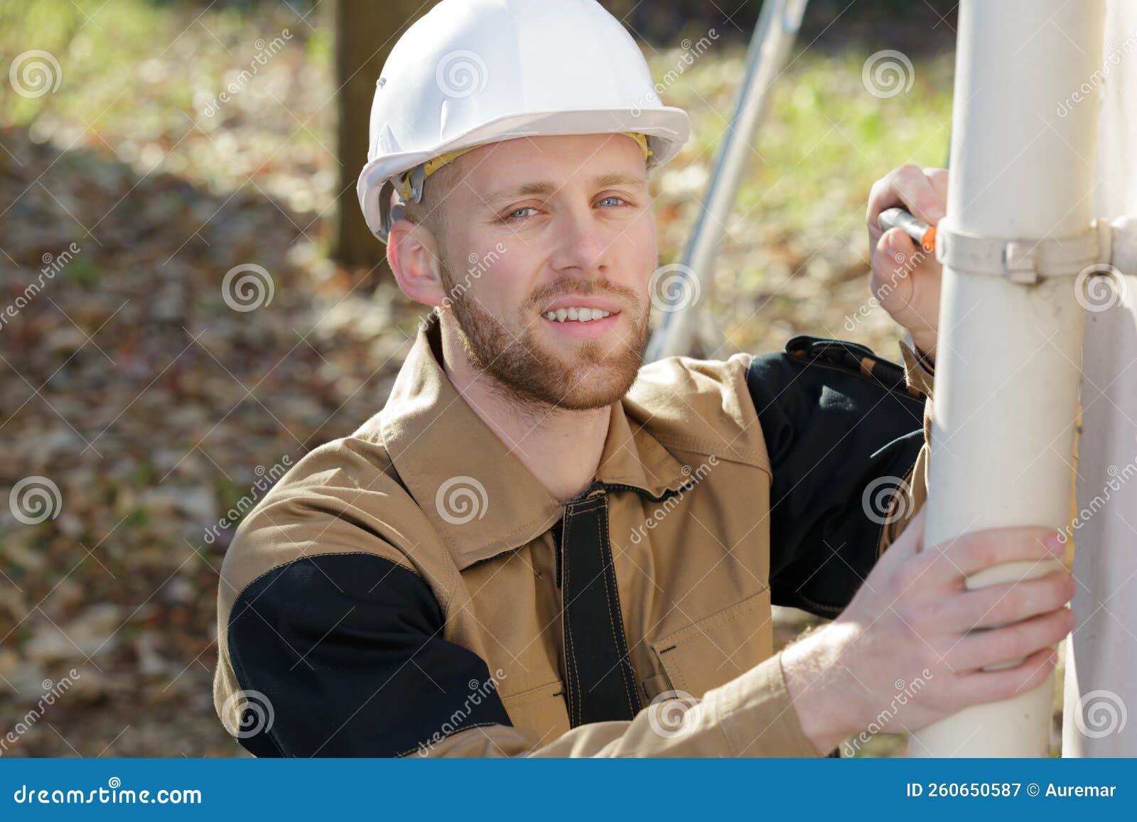 Tradesman Fixing Electrical Issue With Hand Dryer Stock Photo ... Tradesman Fixing Electrical Issue With Hand Dryer Stock Photo ...