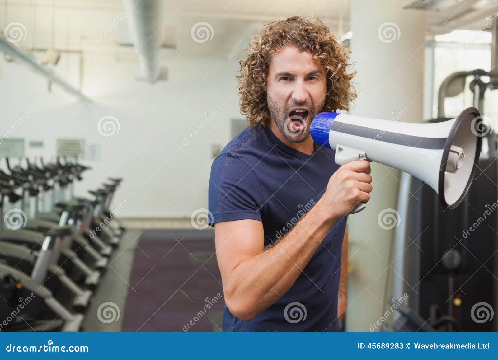 Portrait of Trainer Shouting into Bullhorn in Gym Stock Image - Image ...