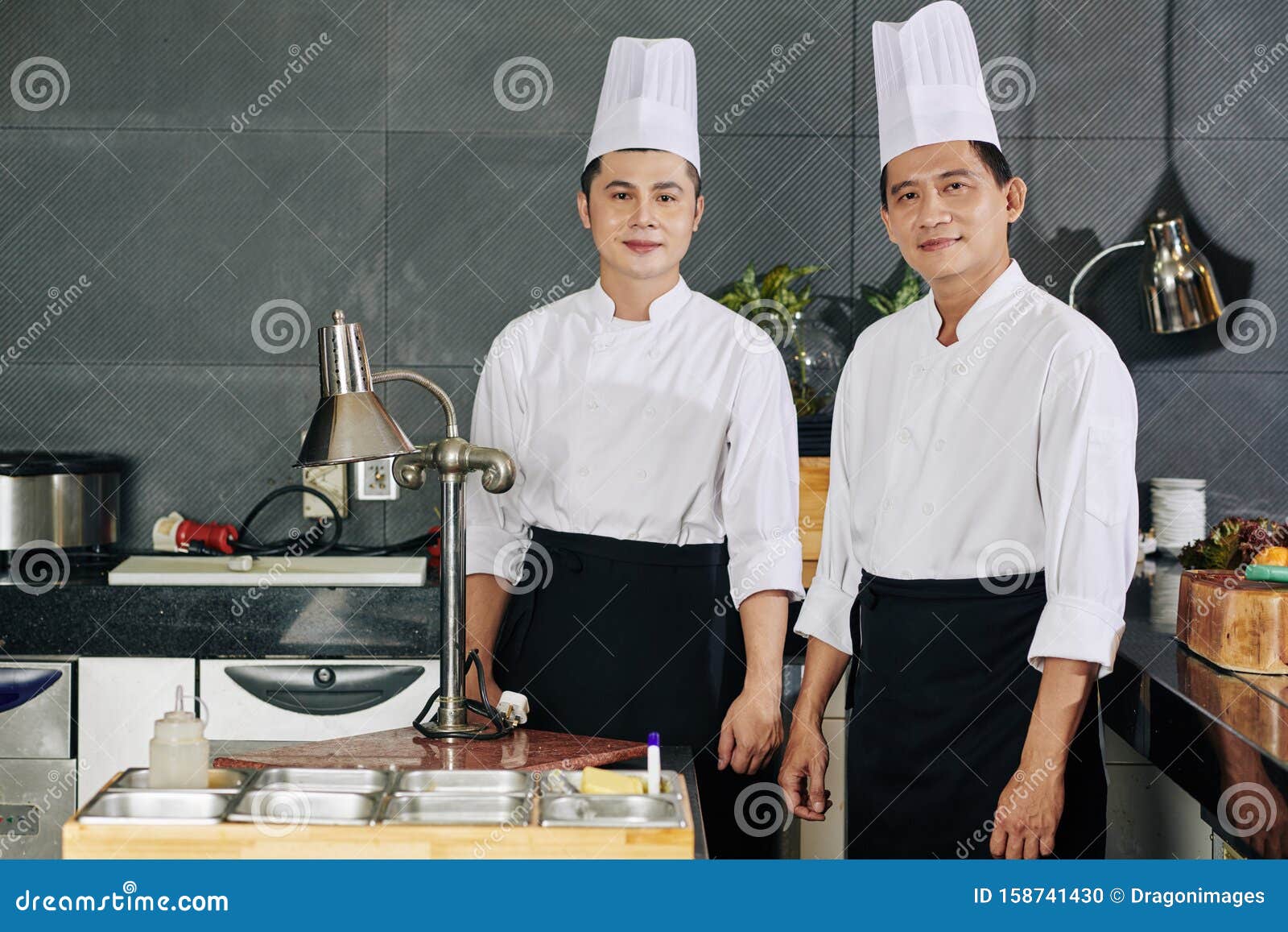 Two Chefs Working in the Kitchen Stock Photo - Image of uniform ...