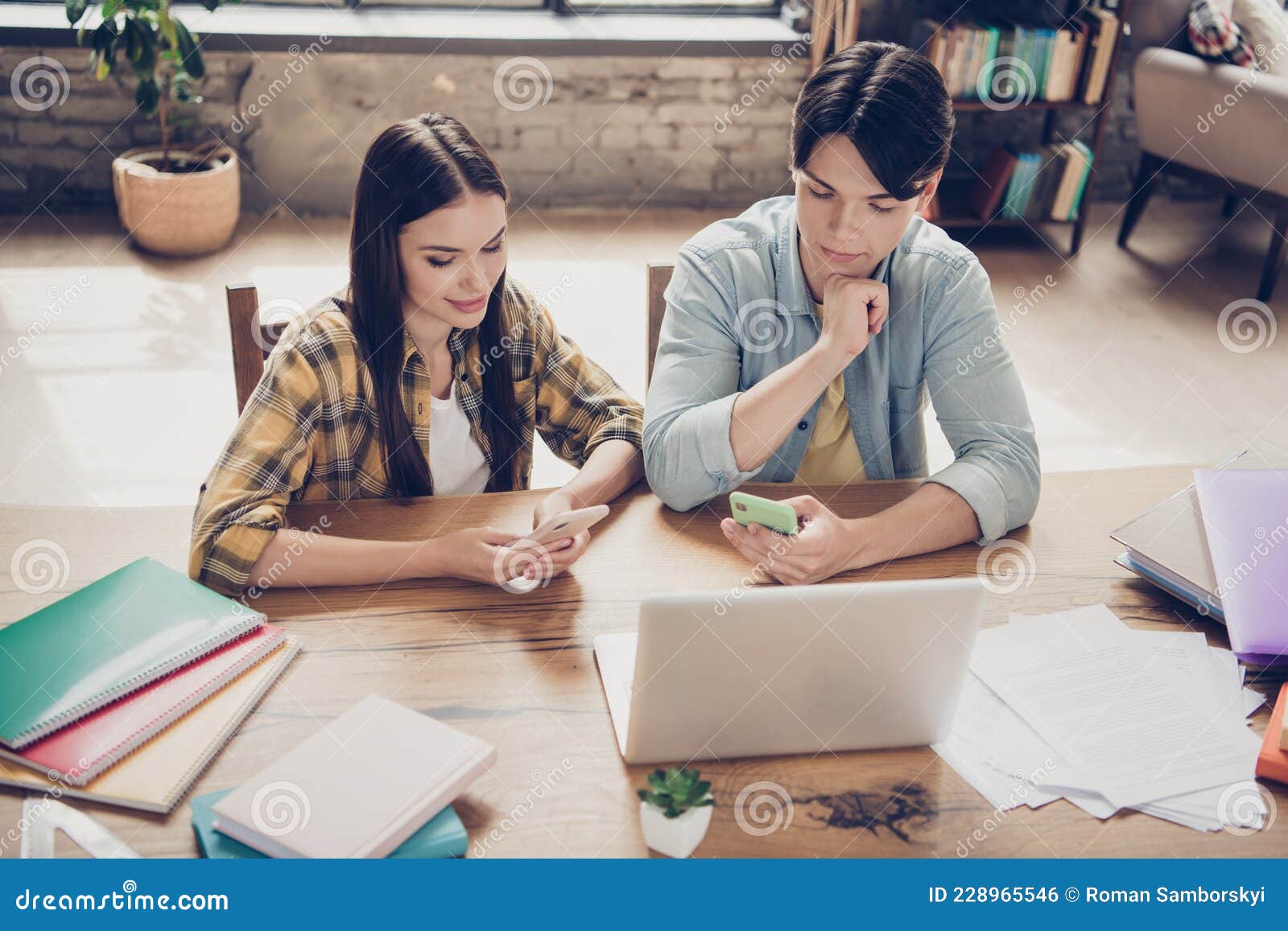 Portrait of Two Attractive Focused Classmates Learners Using Gadgets ...