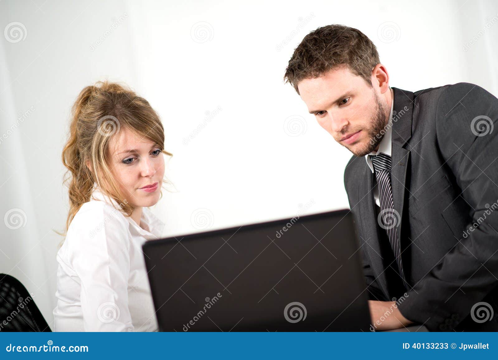 Portrait of Two Business People Working Together in Office with ...