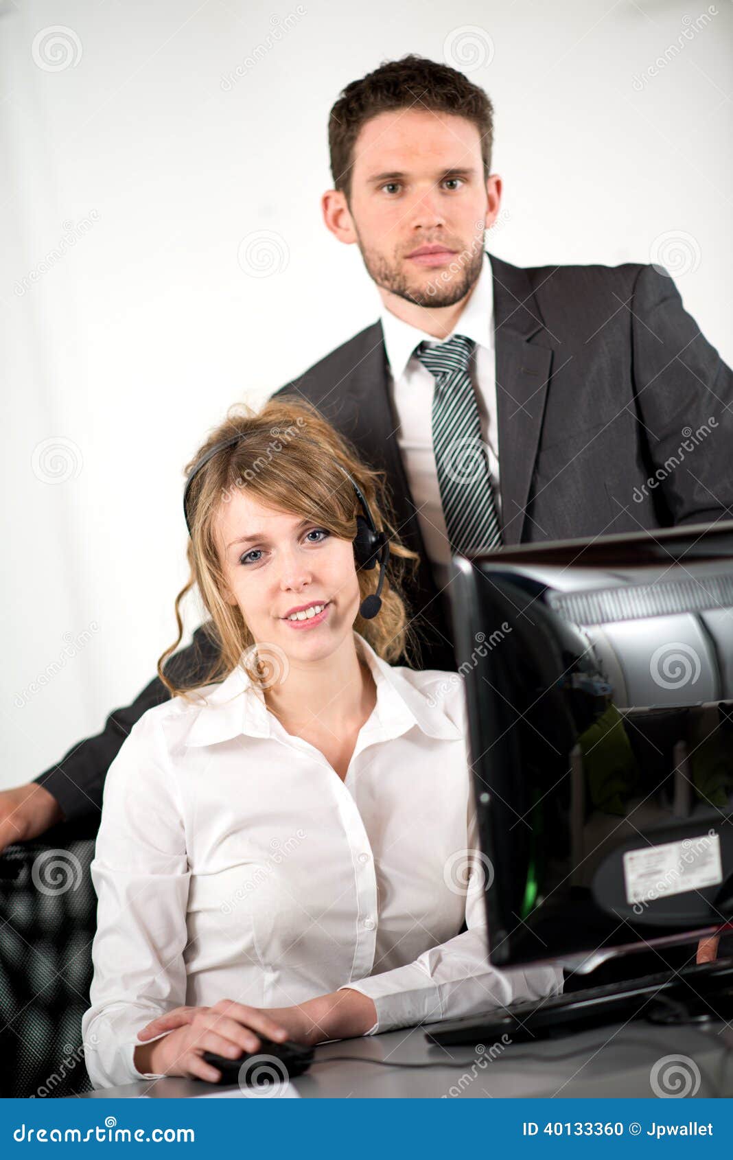 Portrait of Two Business People Working Together in Office with ...