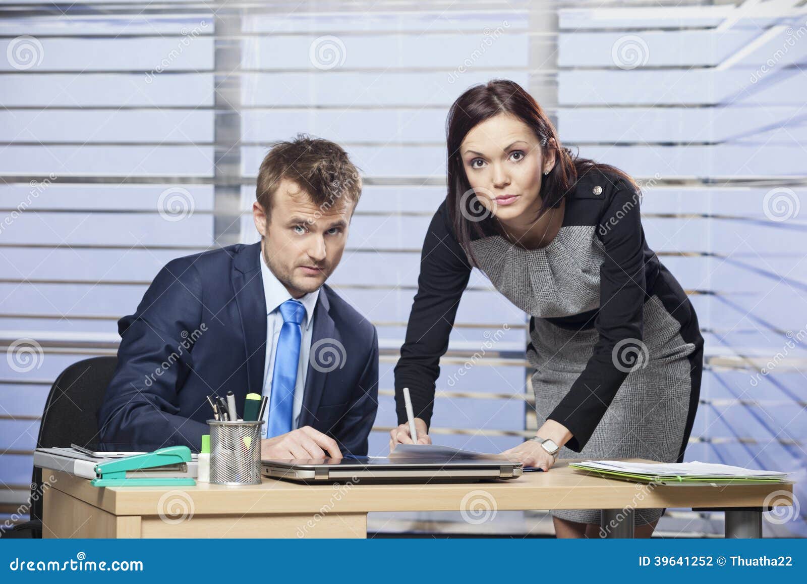 Portrait of a Two Colleagues Signing Documents Stock Photo - Image of ...