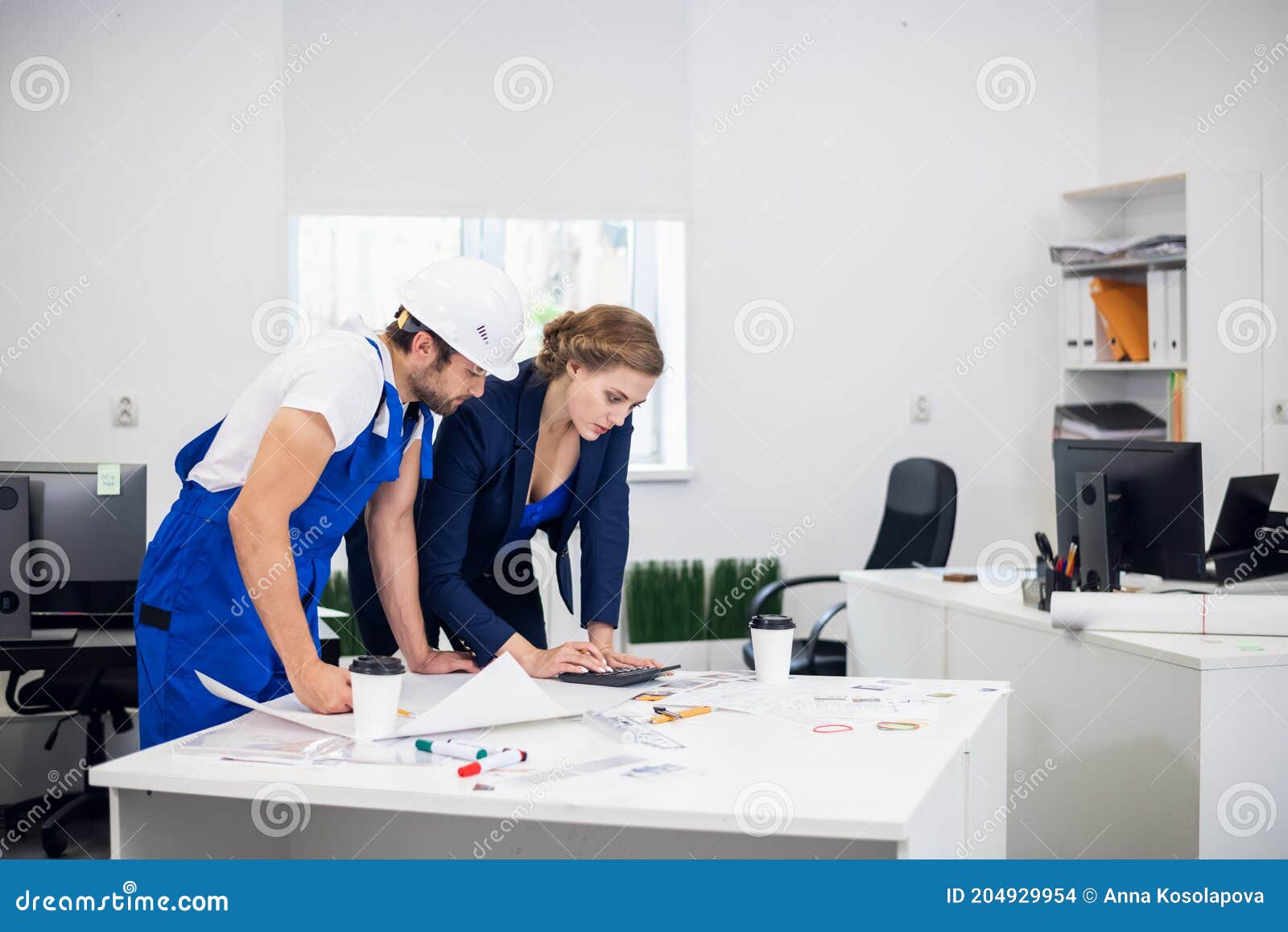 A Portrait of Two Construction Designers Working on a Project Stock ...