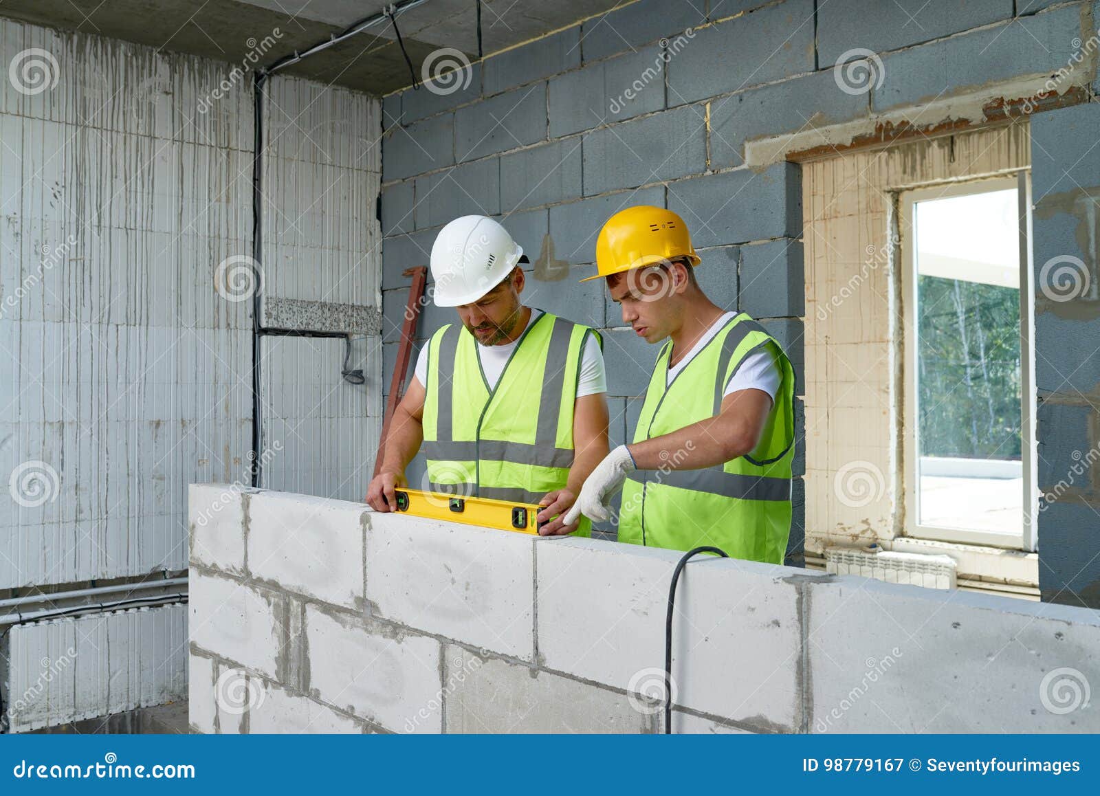 Construction Workers Building Wall Stock Image - Image of worker ...