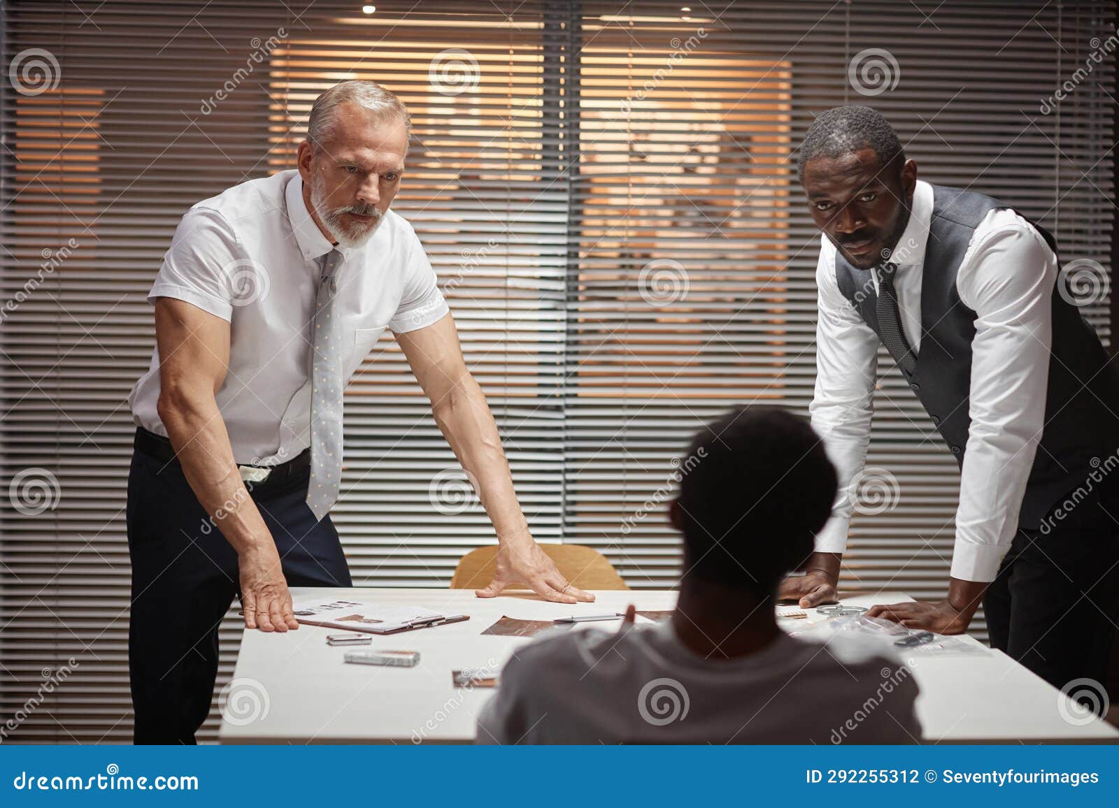 Two Detectives Interrogating Suspect in Criminal Case Stock Photo ...