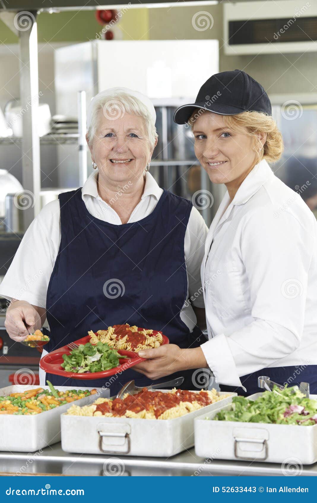 Portrait of Two Dinner Ladies in School Cafeteria Stock Image - Image ...