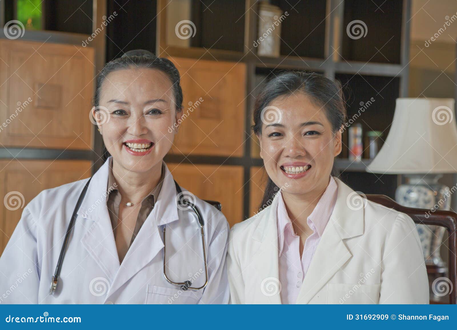 Portrait of Two Doctors stock image. Image of looking - 31692909