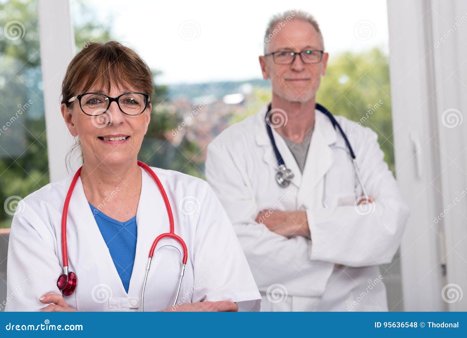 Portrait of two doctors stock photo. Image of hospital - 95636548